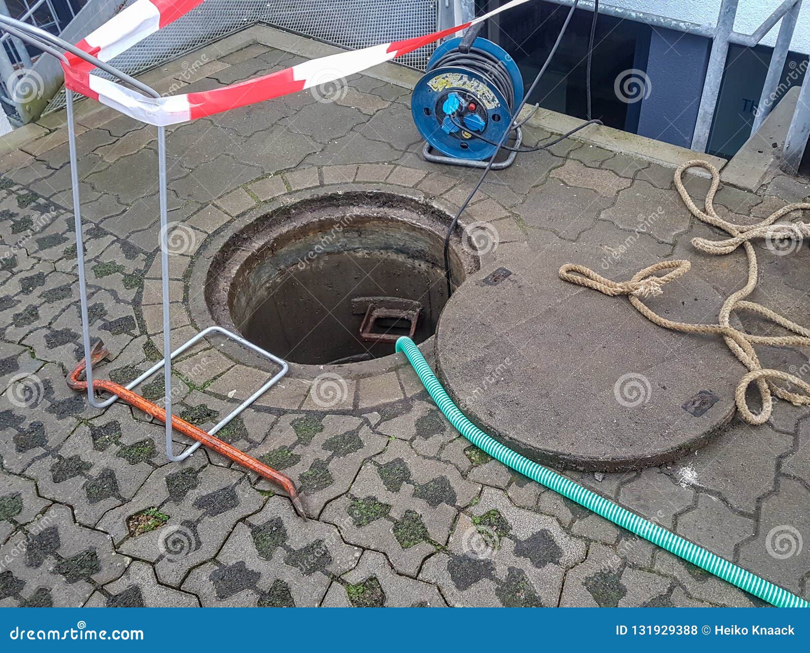 Working in a Manhole from Above Stock Photo - Image of aspirate ...