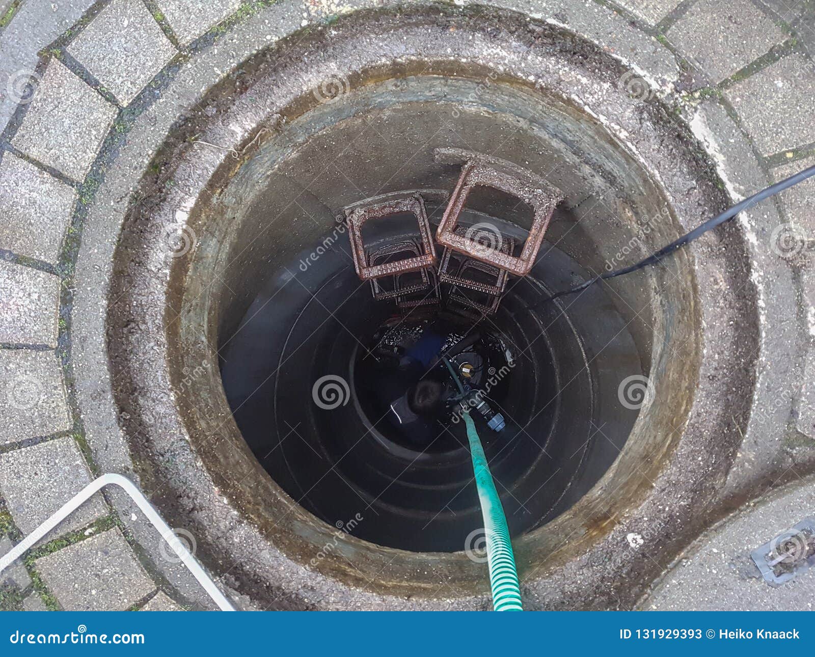 Working in a Manhole from Above Stock Image - Image of construction ...