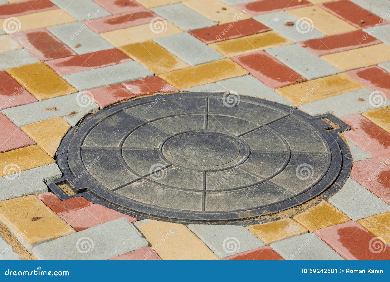 Sewer Manhole Cover Surrounded by an Street Stock Image - Image of pipe ...
