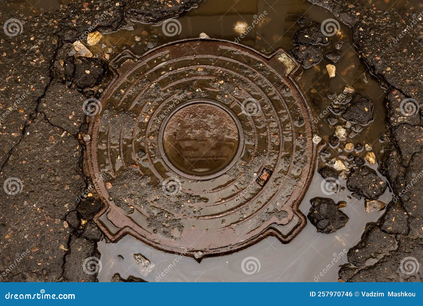 Sewer Manhole in the Water on the Road. Manhole on a Destroyed Asphalt ...