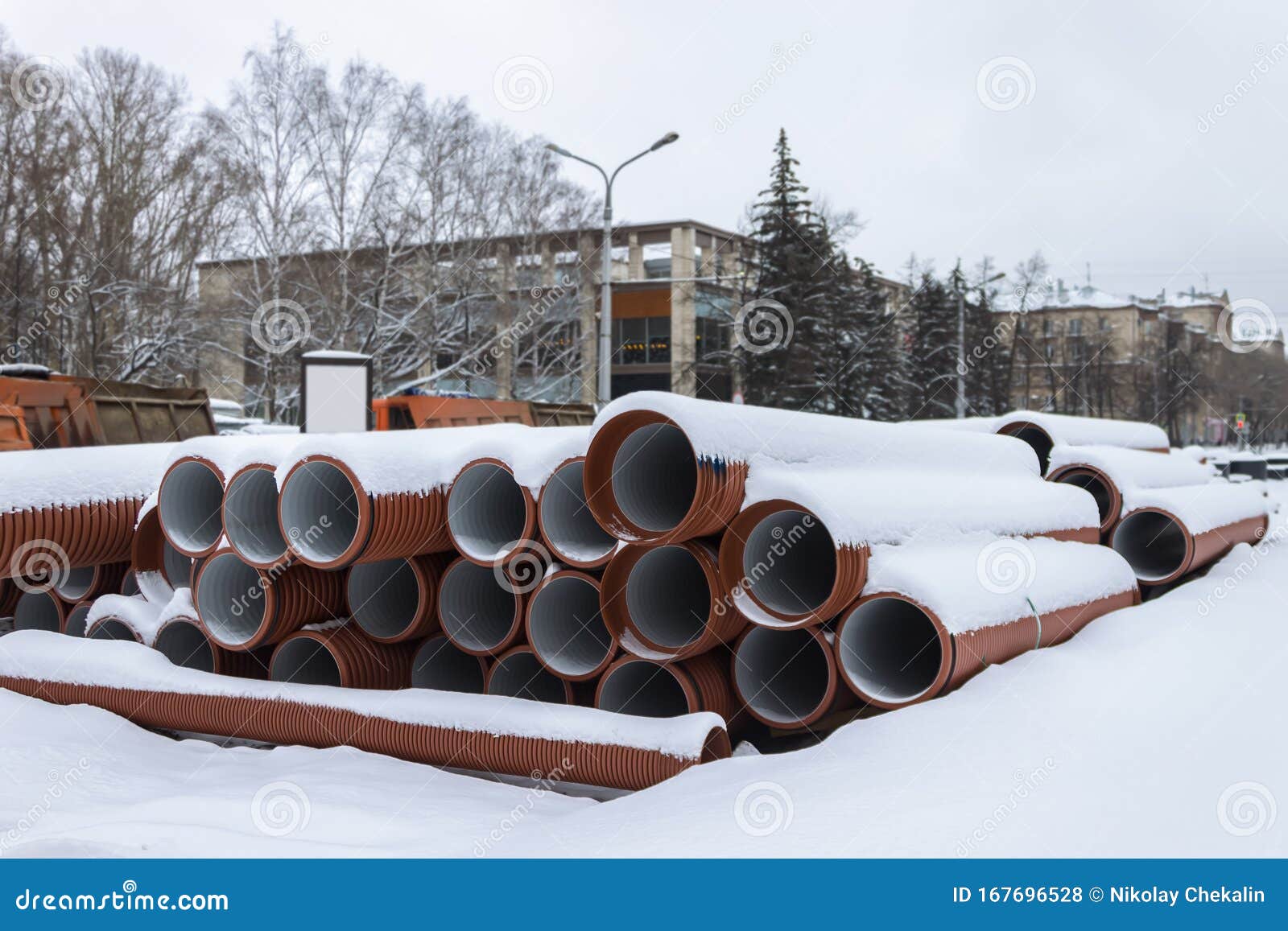 Sewer Pipes Lie on a Construction Site, Covered with Snow Stock Photo ...