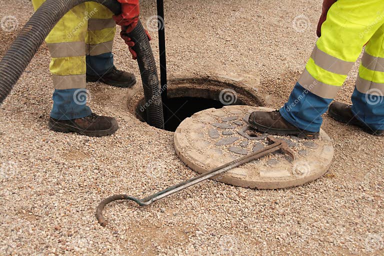 Sewer workers in action stock photo. Image of network - 17052128