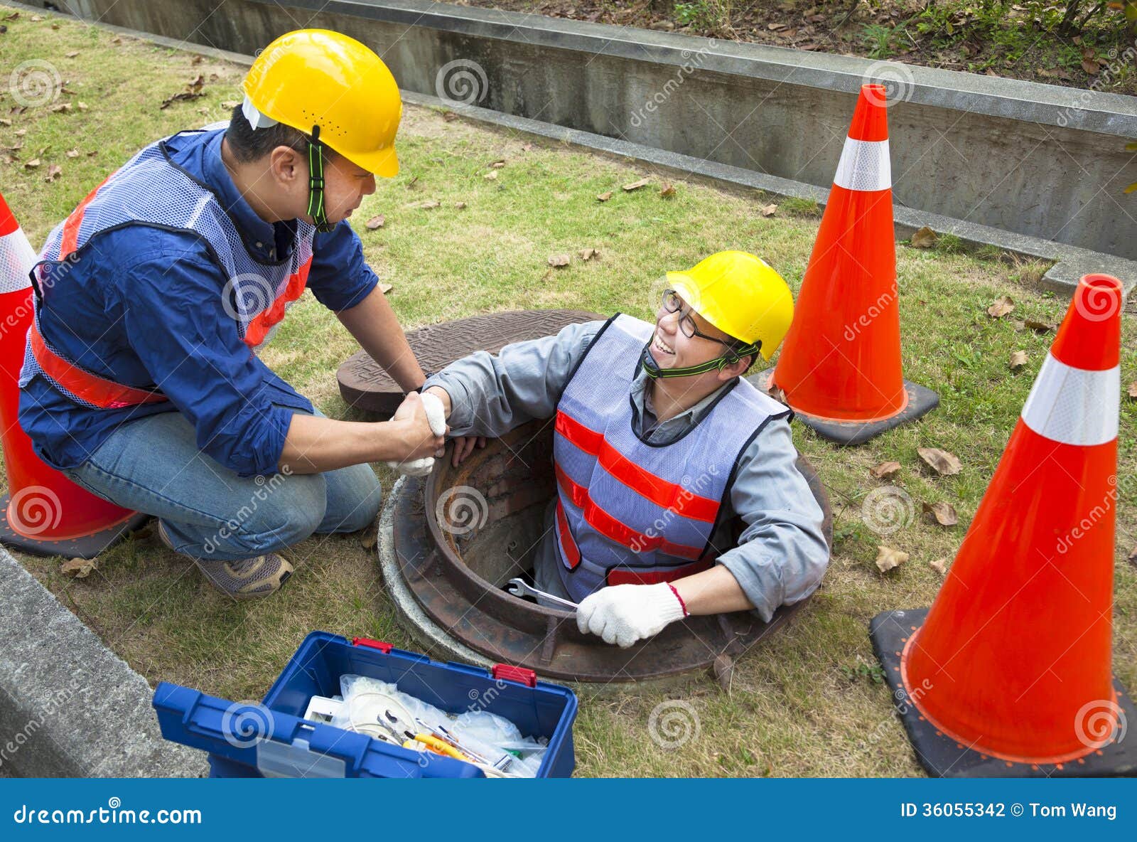 Sewerage Workers in the Manhole Stock Photo - Image of hole, equipment ...