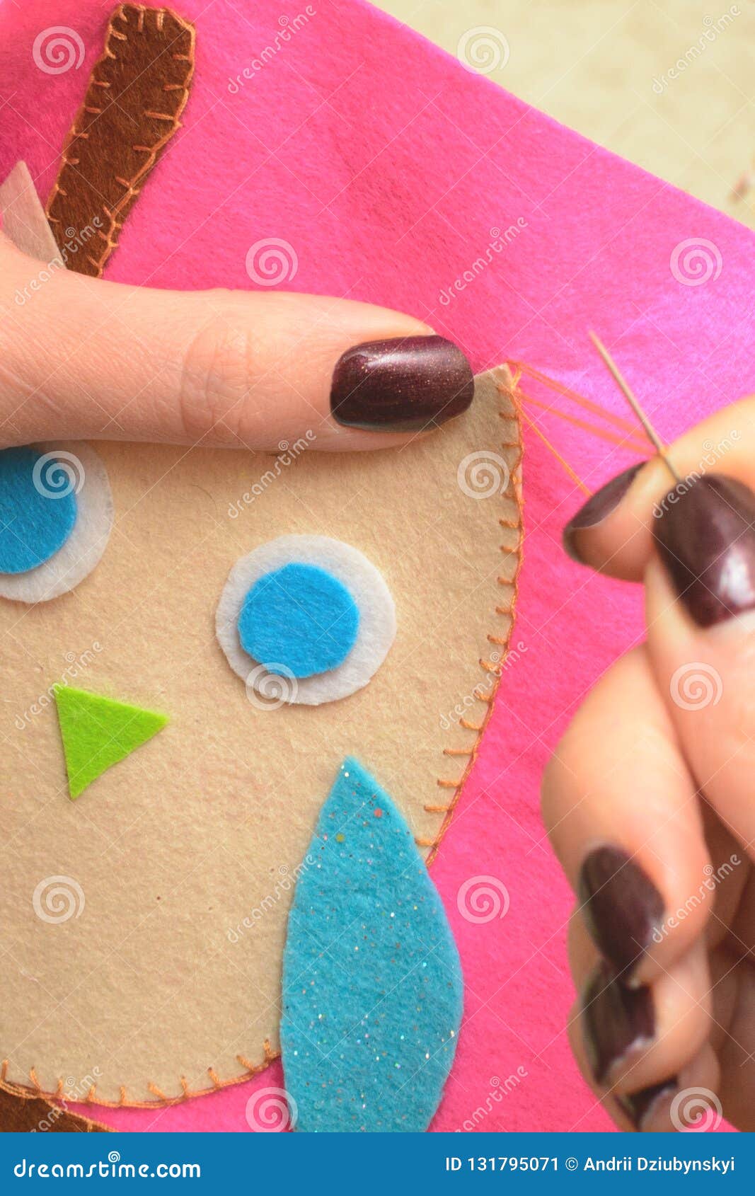 Sewing Application of a Owl of Felt with a Thread and a Needle Stock ...