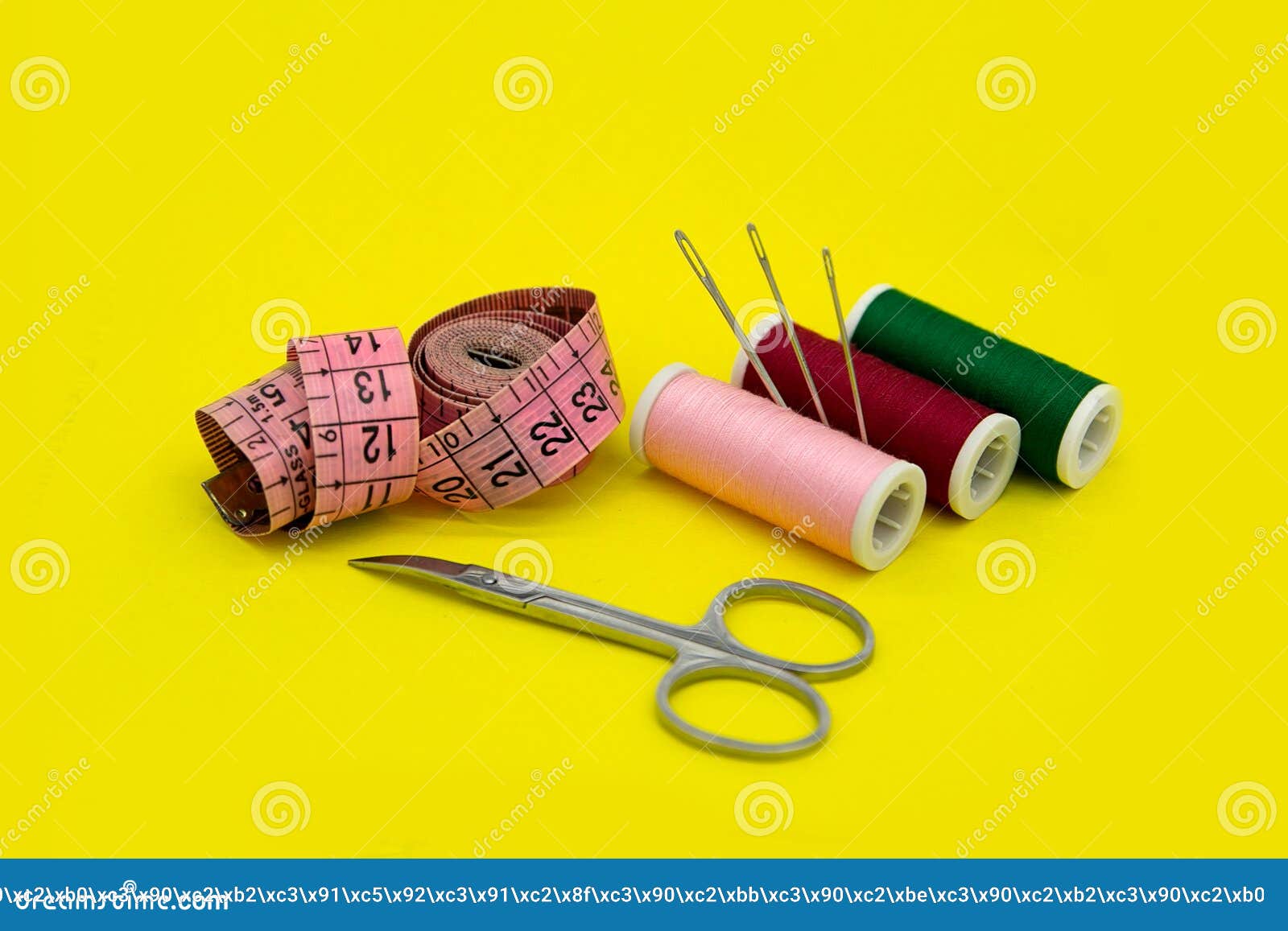 Sewing Items Thread, Needles, Scissors, Measuring Tape on a Yellow ...
