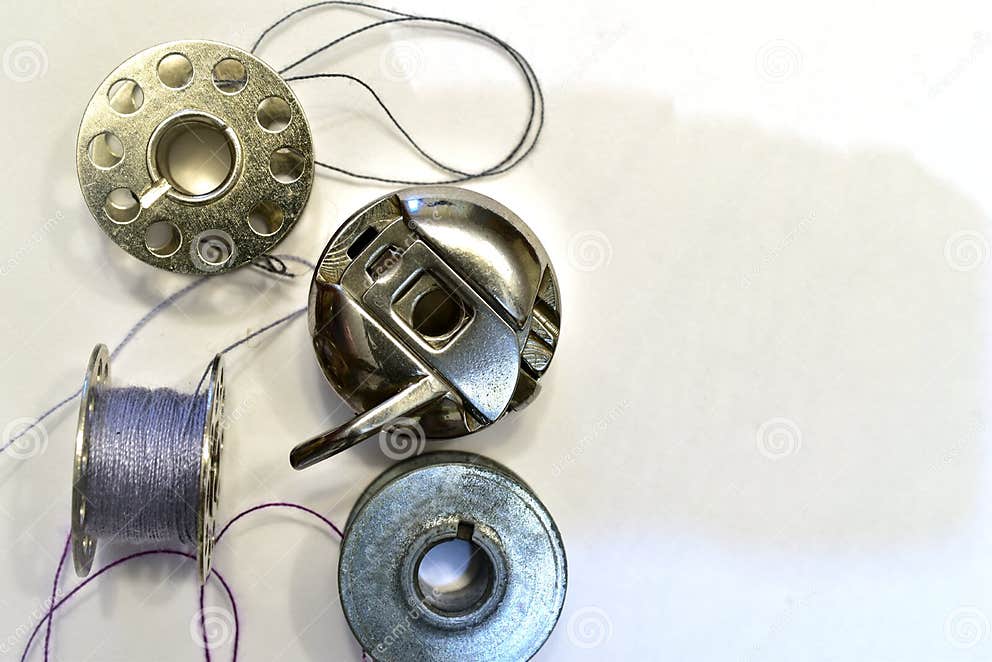 Sewing Machine Bobbin and Hook Set. Stock Photo - Image of cloth ...