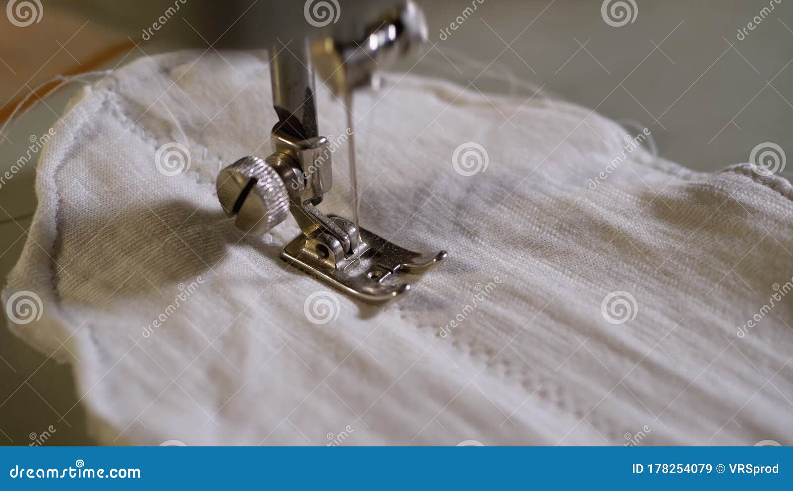 Sewing Machine Needle in Slow Motion. a Tailor Sews Homemade Face Mask ...