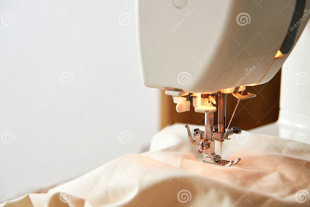 Sewing Machine with Piece of Beige Fabric Stock Photo - Image of ...