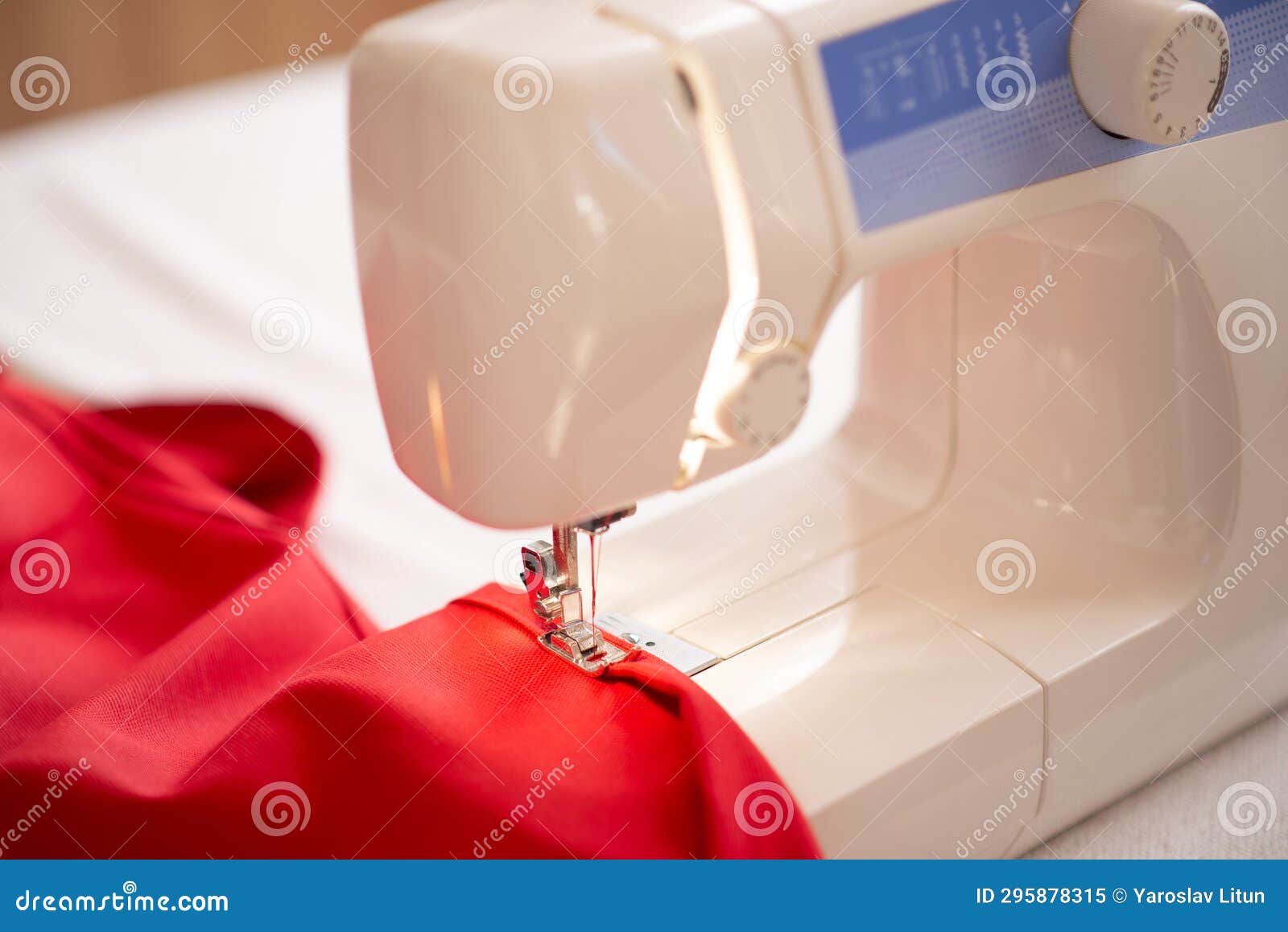 Sewing Machine with Red Cloth Closeup. Sewing Process in the Re ...