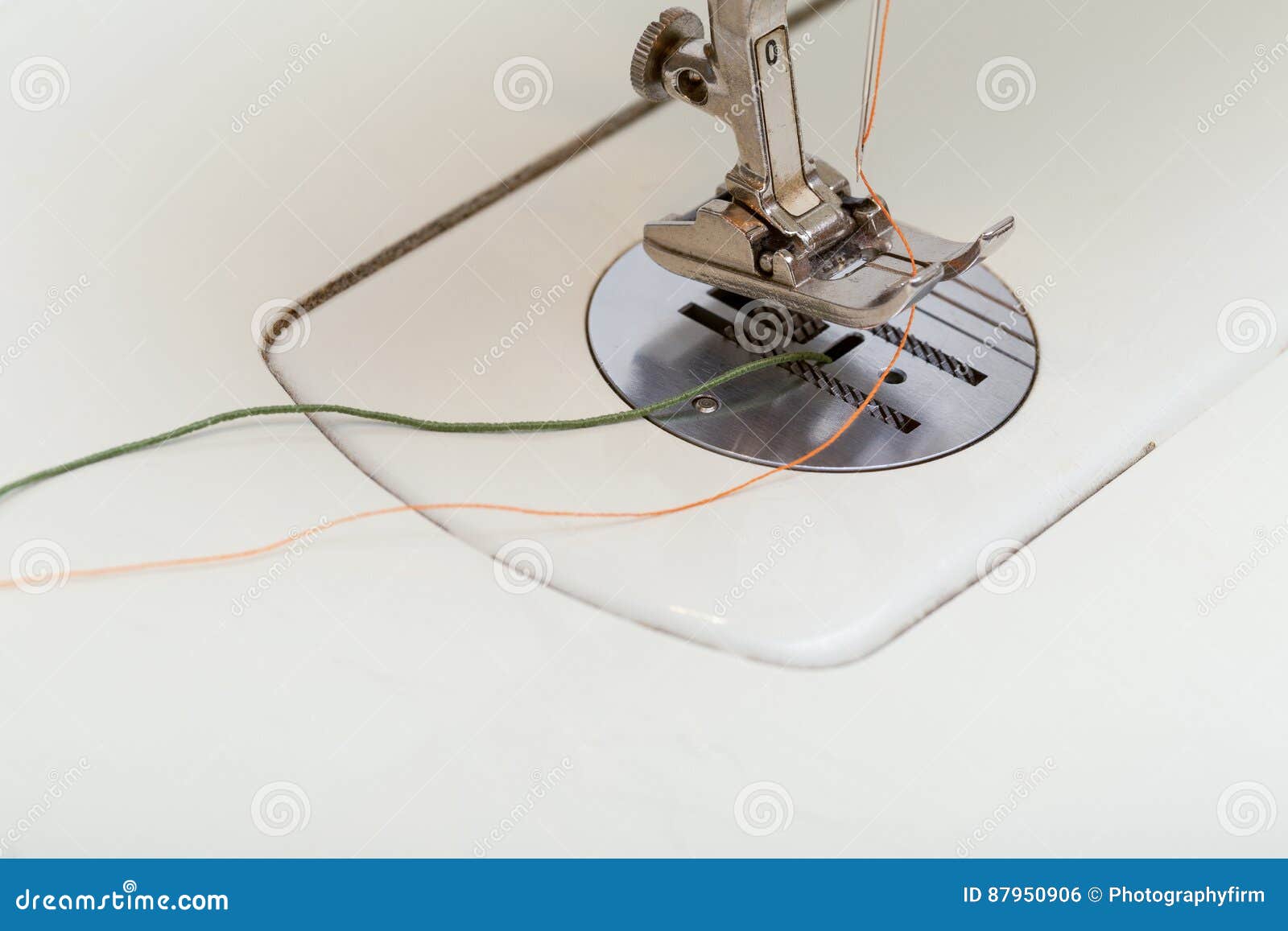 Sewing Machine Threaded with Green and Orange Thread Stock Photo ...