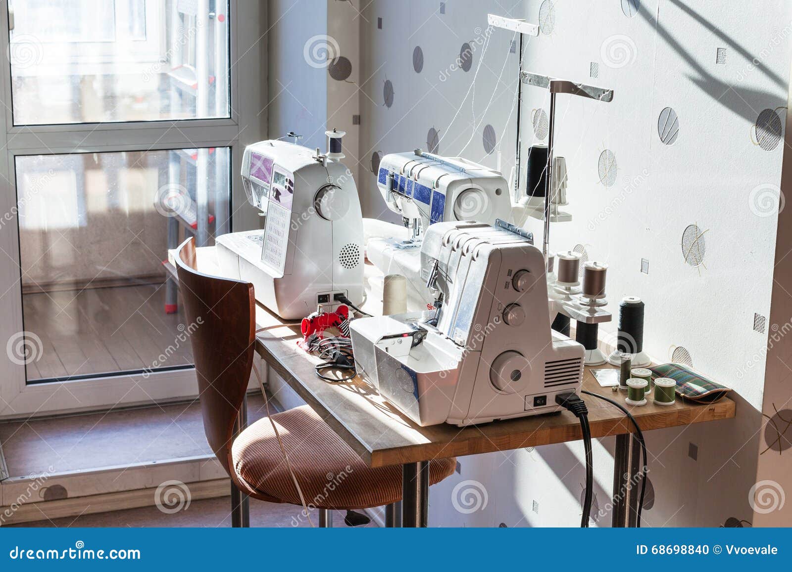 Sewing Machines and Serger on Table Stock Photo - Image of thread ...