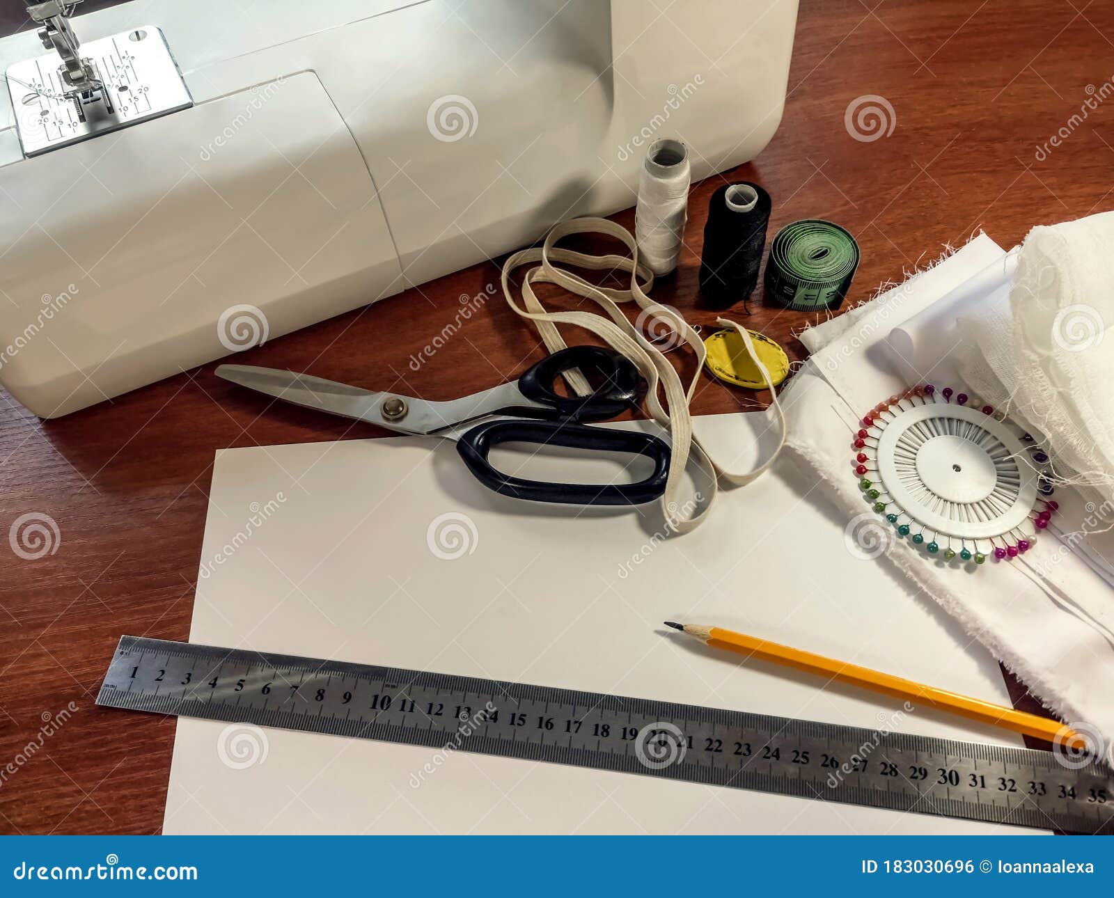 Sewing Materials Lie on the Brown Surface of the Table. Ruler, Pencil ...