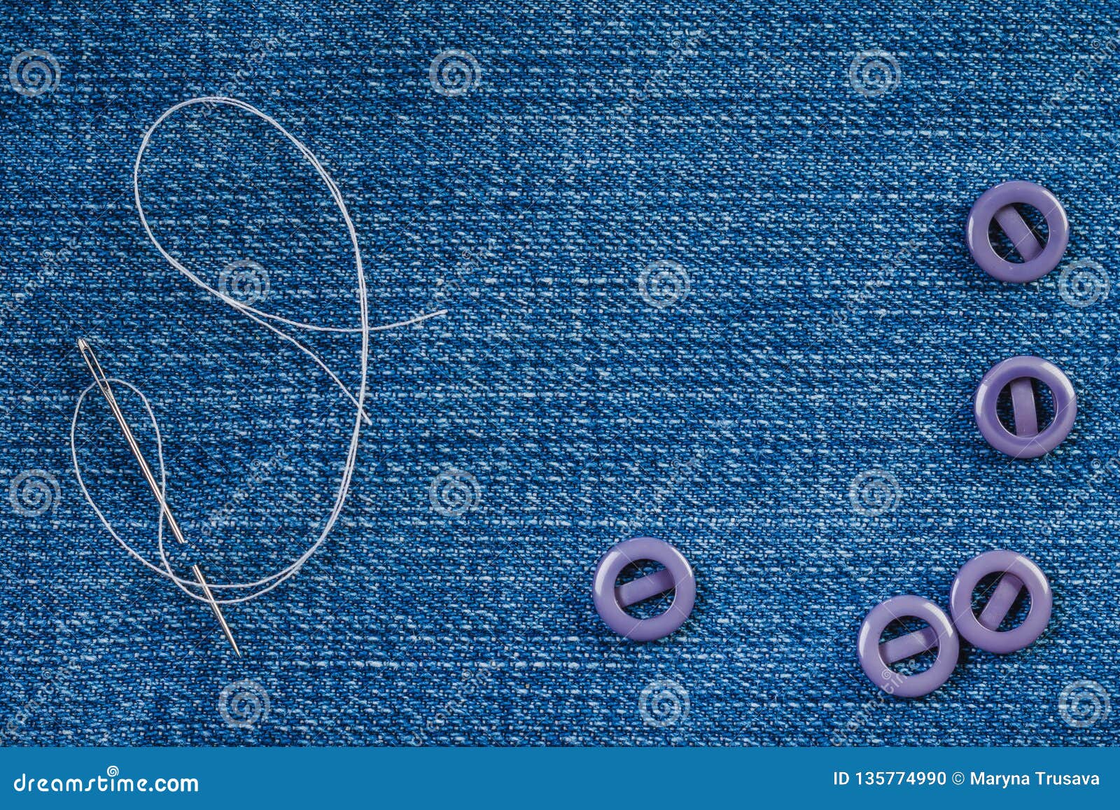 Sewing Needle with a White Thread and Lilac Buttons on a Denim Fabric ...