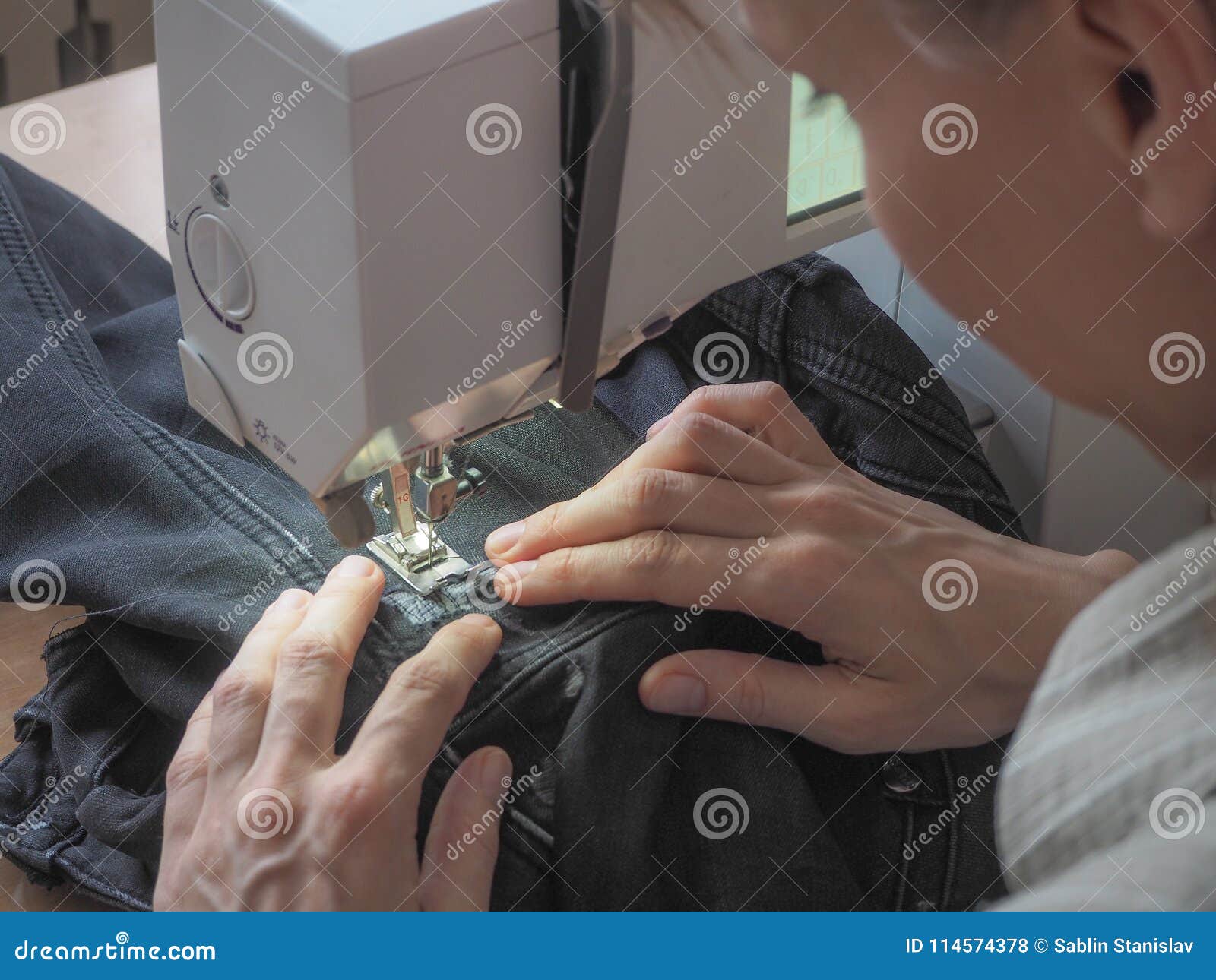 Darning Jeans on a Sewing Machine. Stock Photo - Image of darning ...