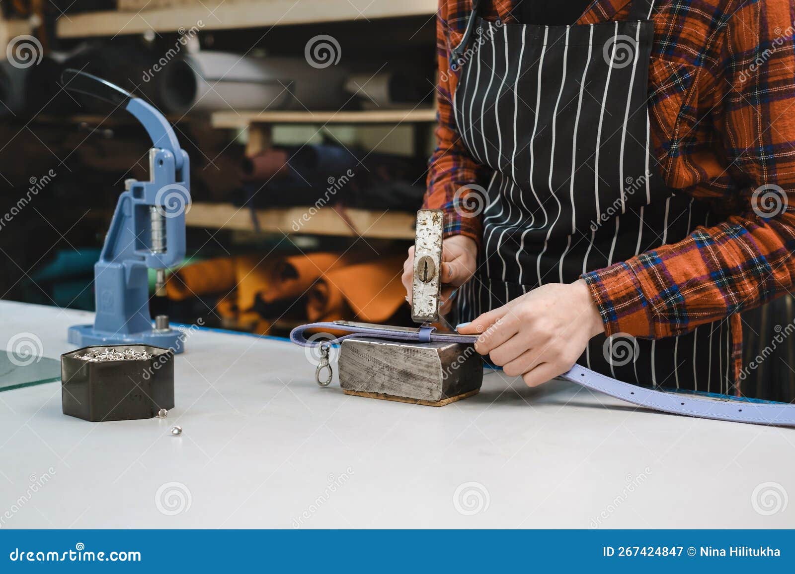 Sewing Process. Cropped View of the Tailor Making Holes for the Buckle ...