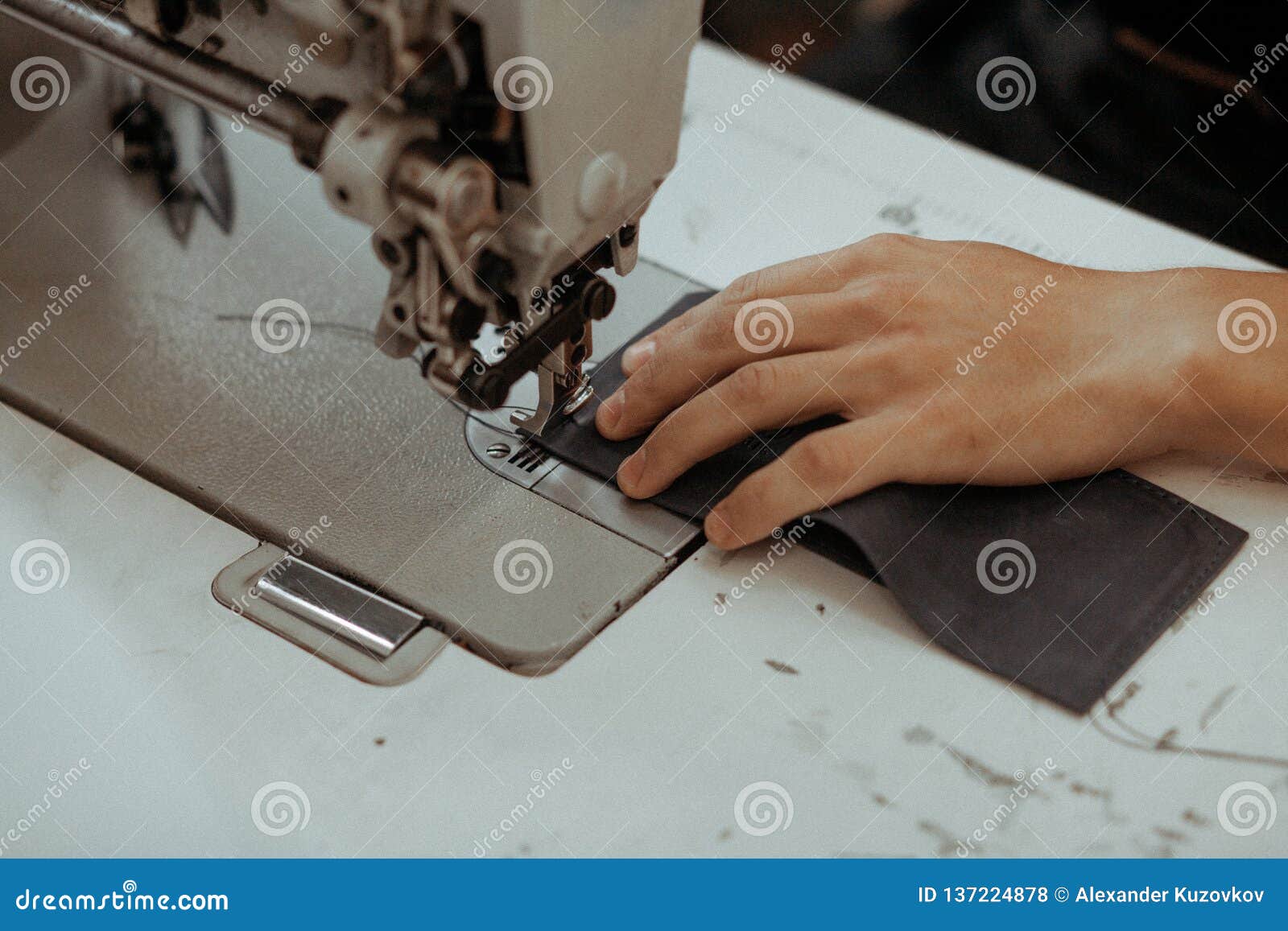 Sewing Process of the Leather Wallet. Man`s Hands Behind Sewing ...