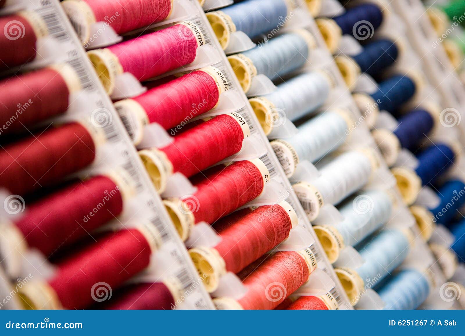 Sewing reels red to blue stock image. Image of sewing - 6251267
