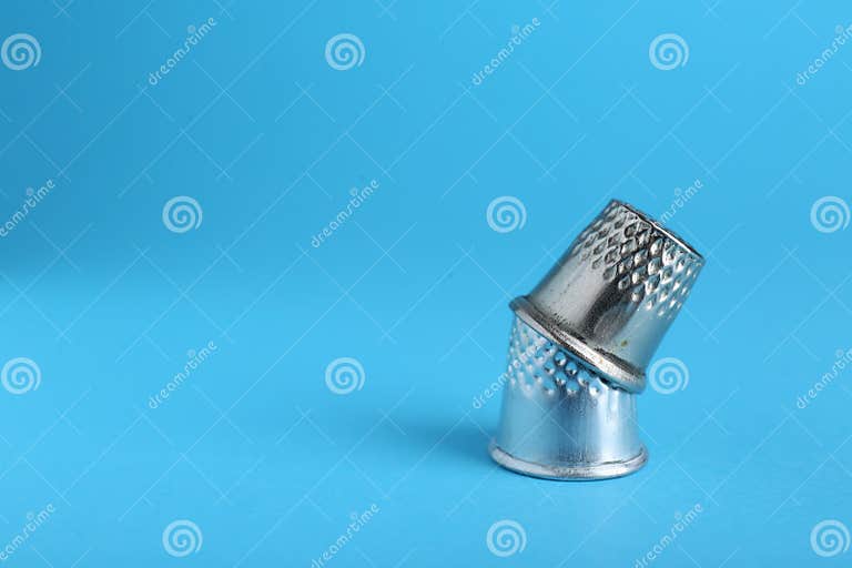 Sewing Thimbles on Light Blue Background, Closeup. Space for Text Stock ...
