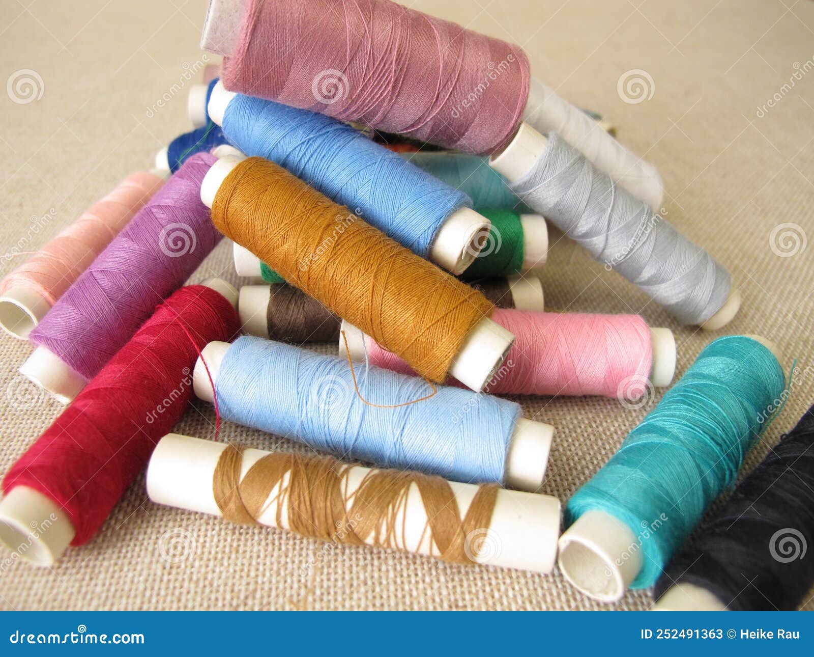 Sewing Thread in Different Colors on Farbric Stock Image - Image of ...