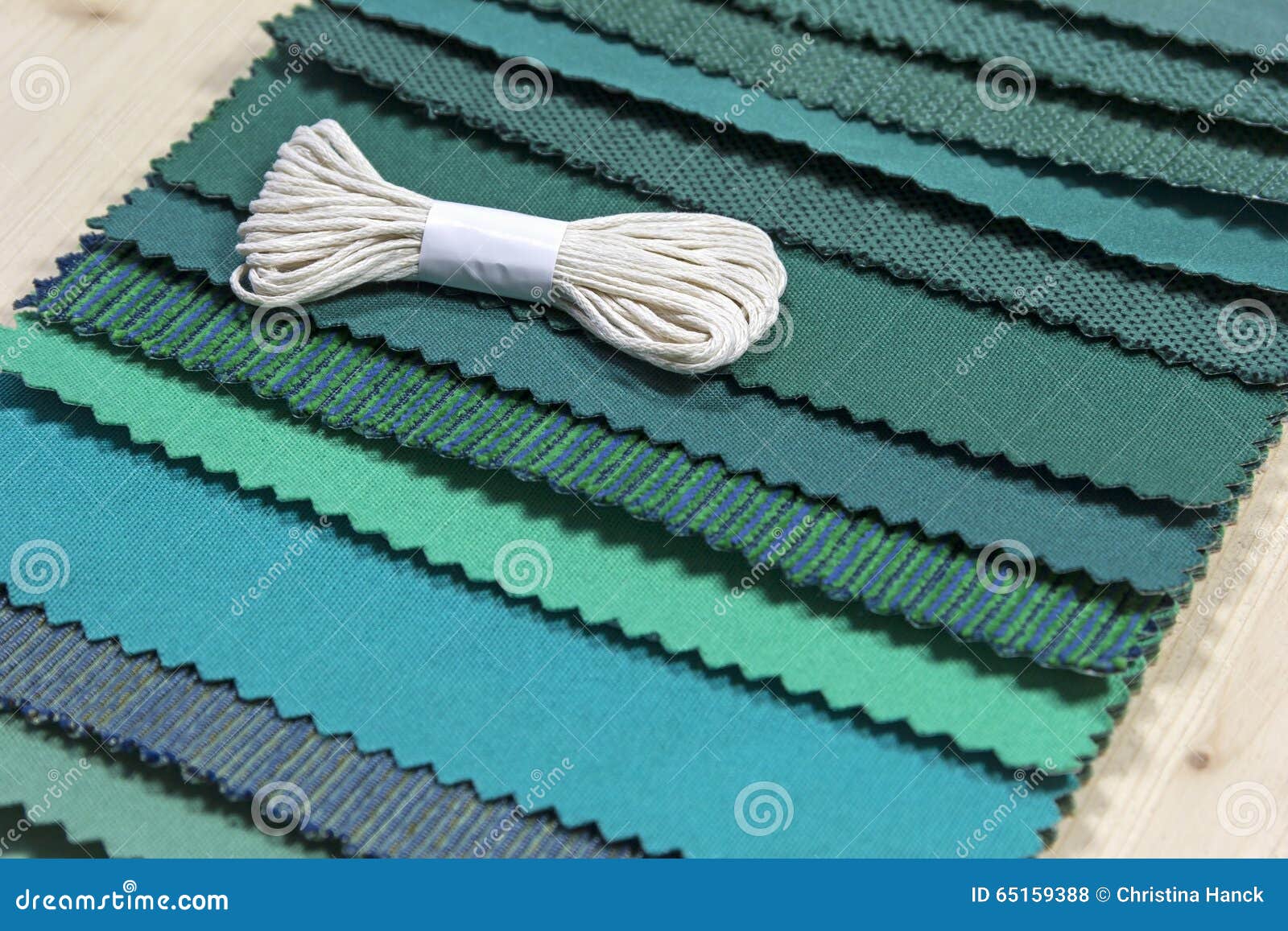 Sewing Thread Lies on Different Fabric Patterns Stock Photo - Image of ...