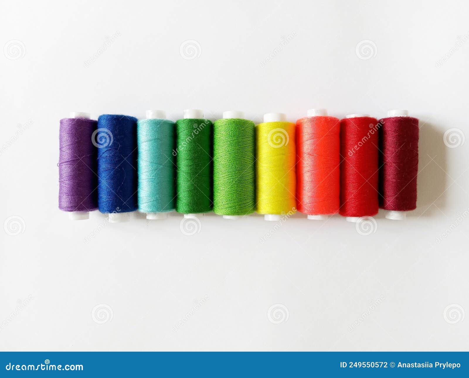 Sewing Threads Arranged in Rainbow Order on White Background Stock ...