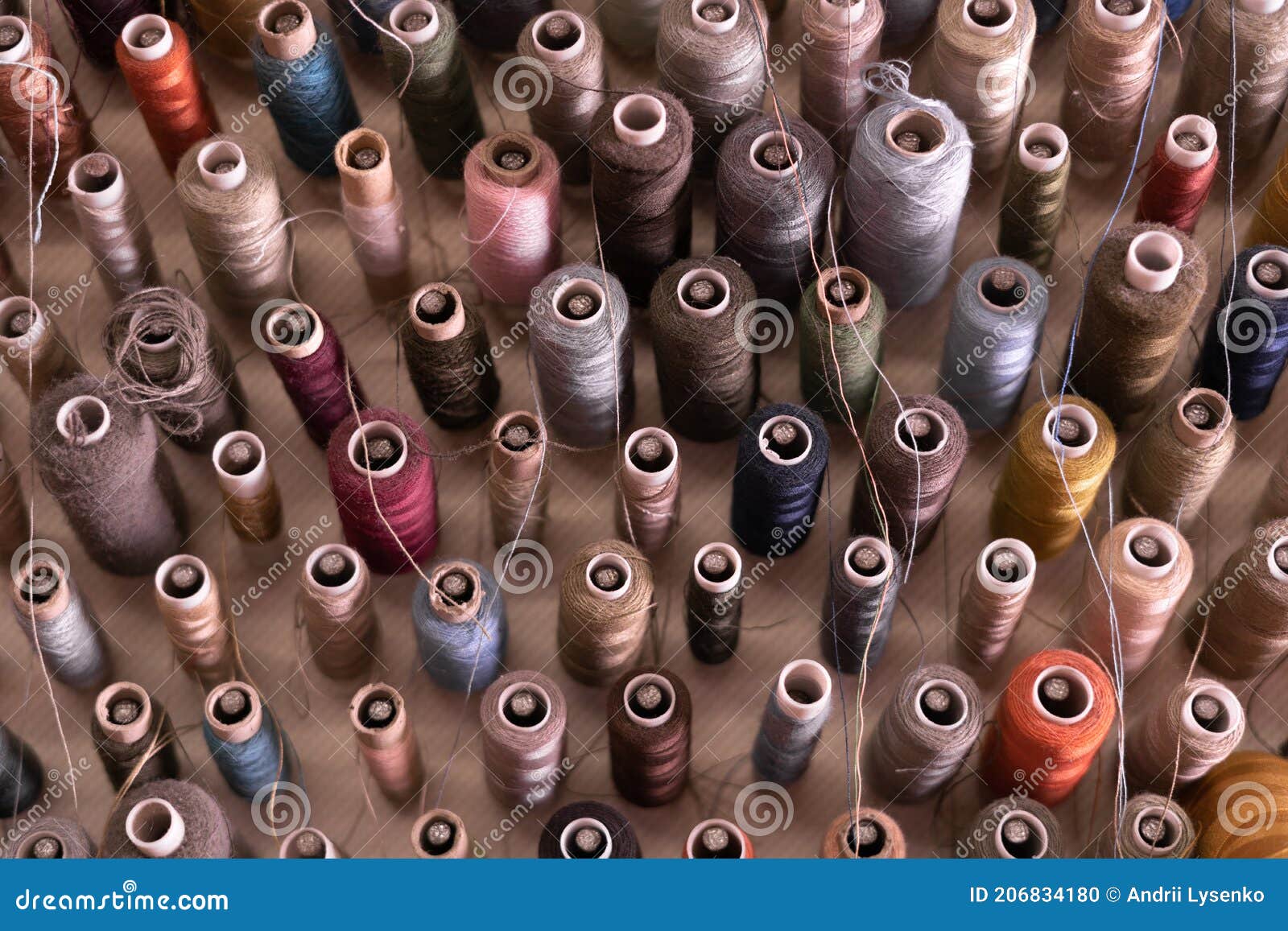 Sewing Threads of Different Colors are Installed on a Metal Wall and ...