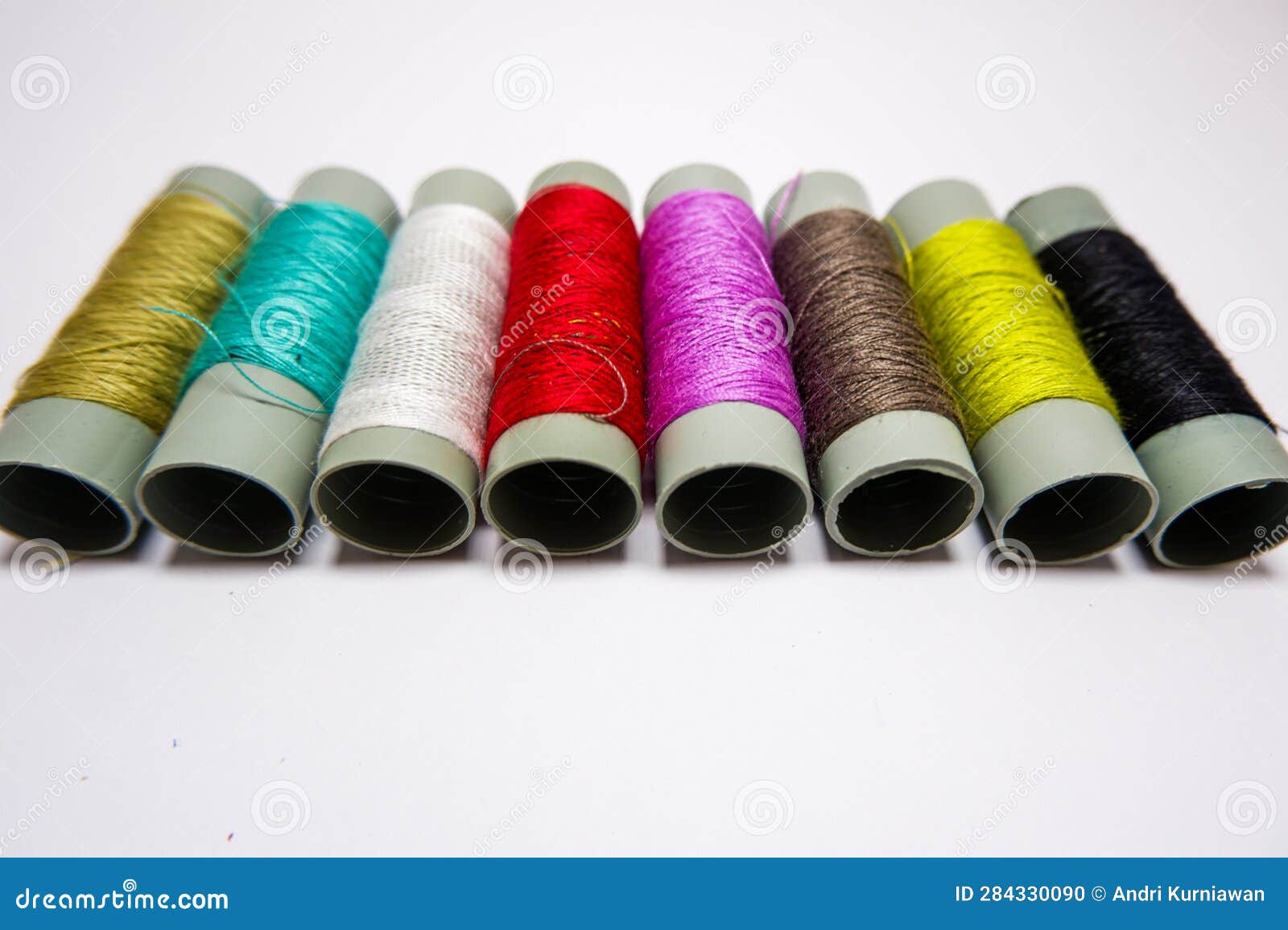 Sewing Threads of Different Colors on White Background. Stock Photo ...