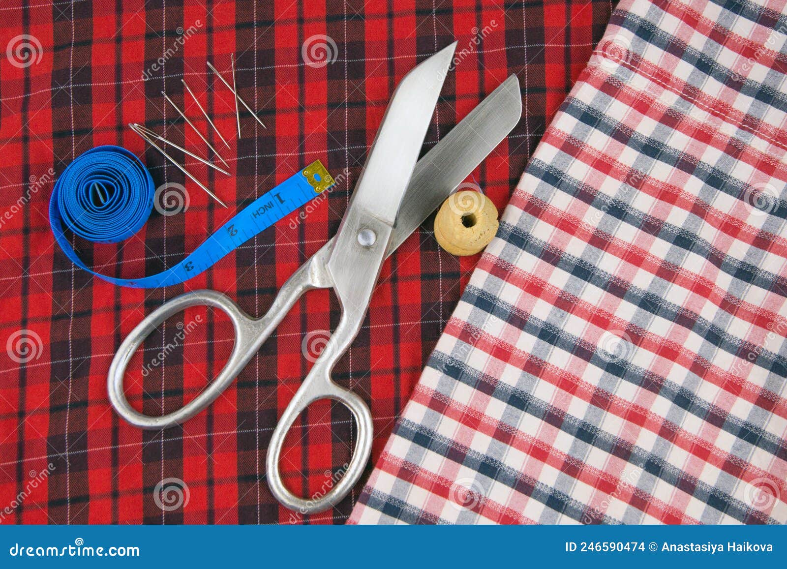 Sewing Tools: Large Scissors and Thread with Needles Lying on a ...