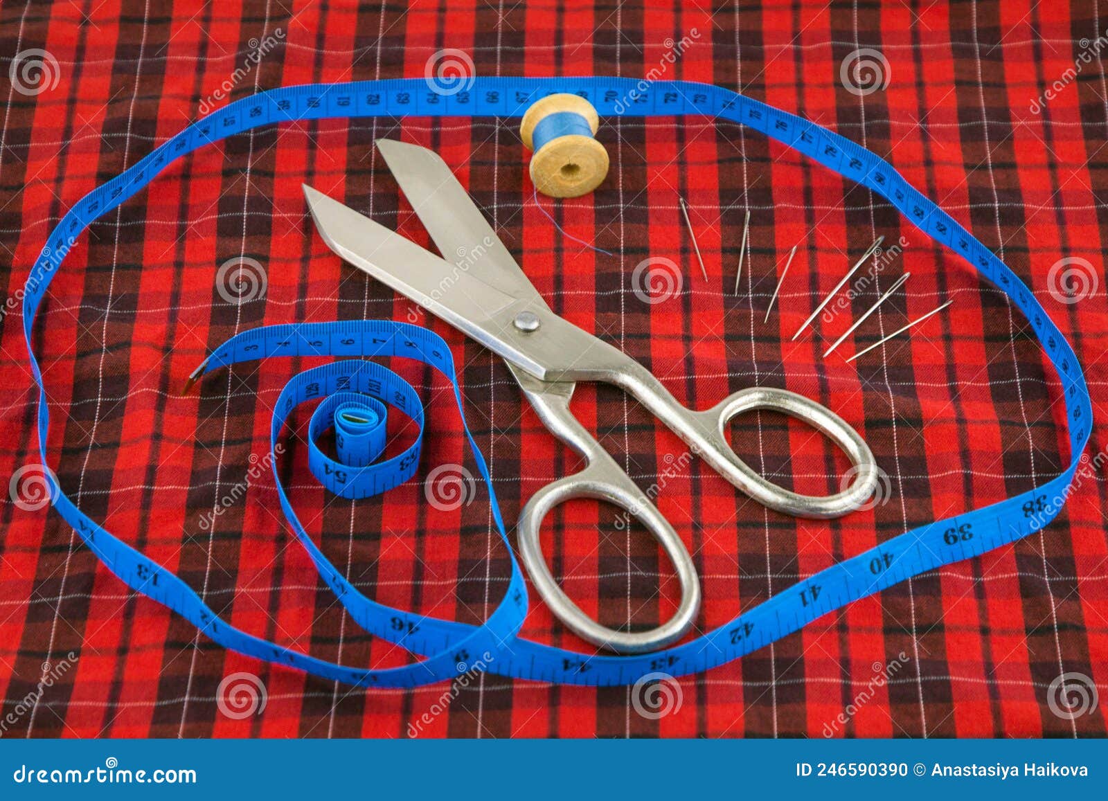 Sewing Tools: Large Scissors and Thread with Needles Lying on a ...