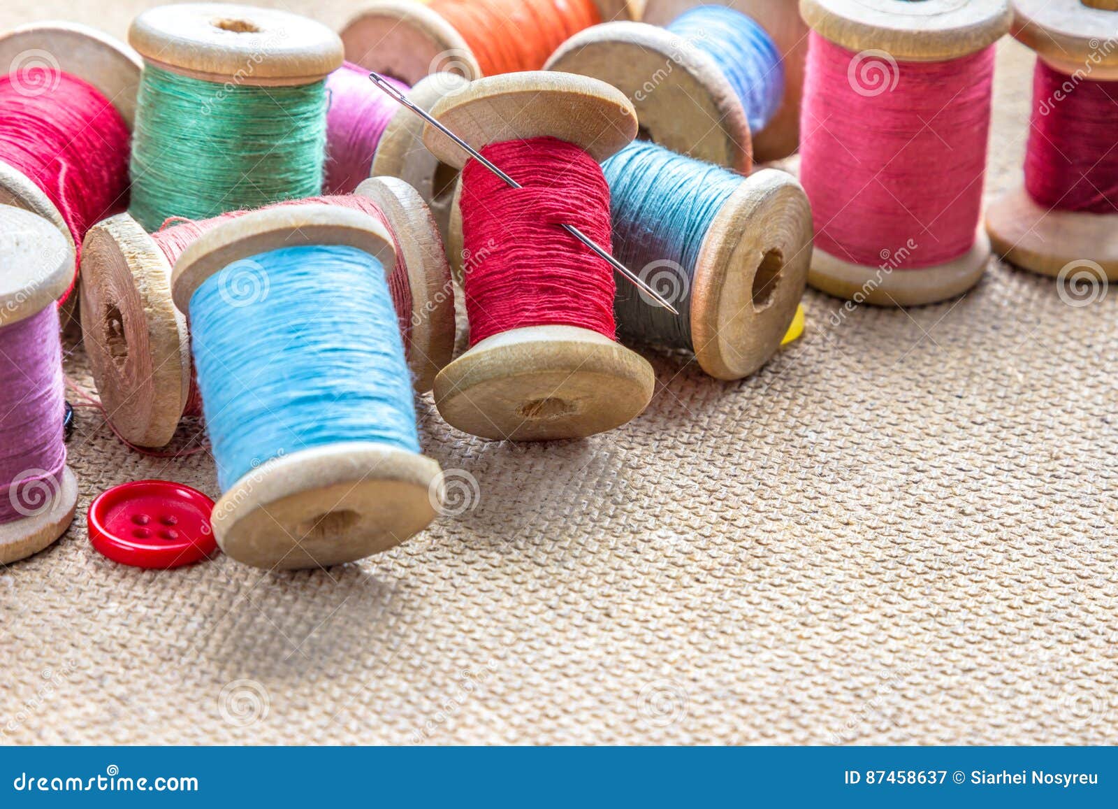 Sewing Tools Many Different Colorful Thread, Needle, Buttons on Wooden ...