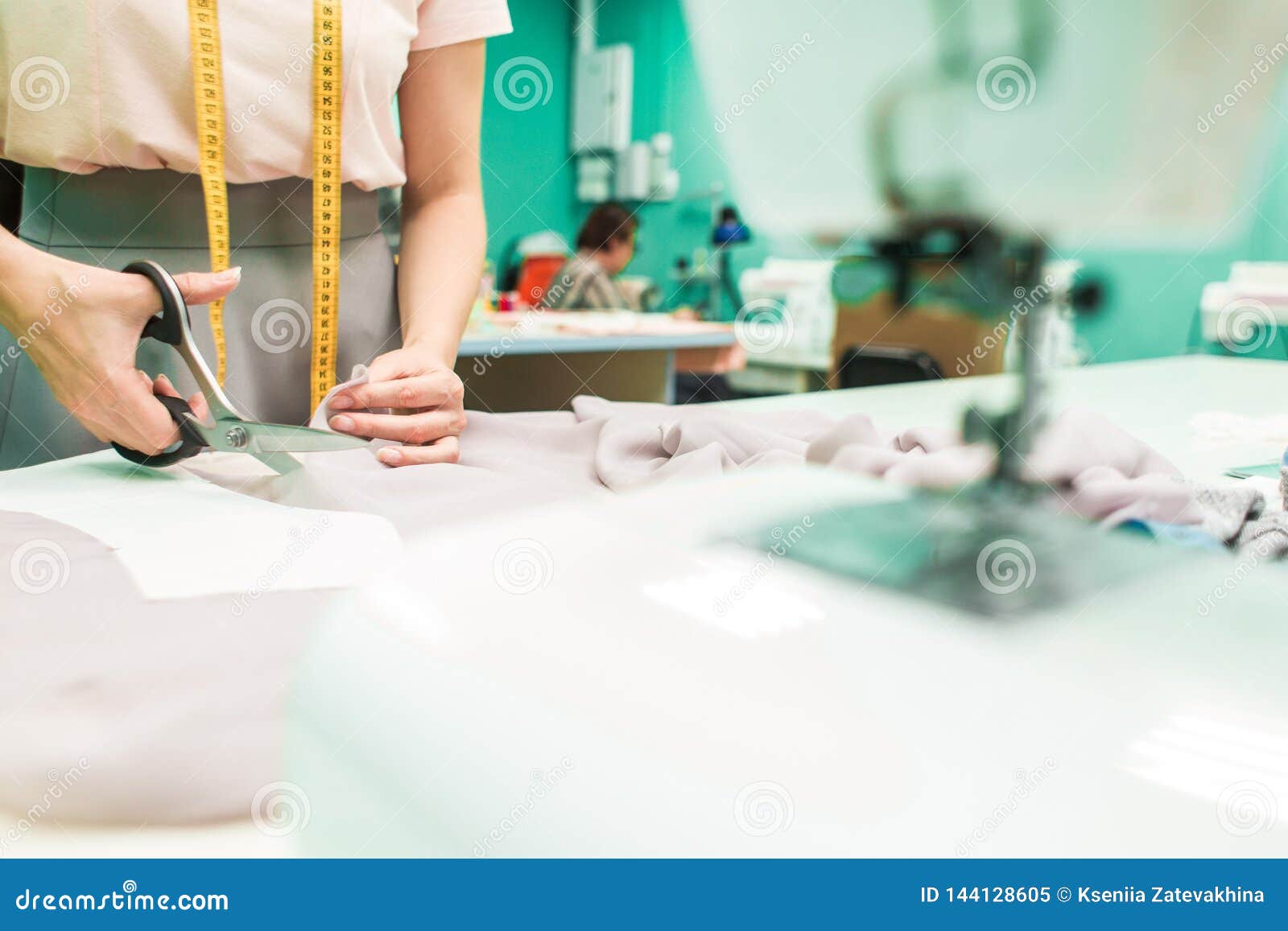 Sewing Workshop. Seamstress at Work. Marking and Cutting Fabric. Stock ...