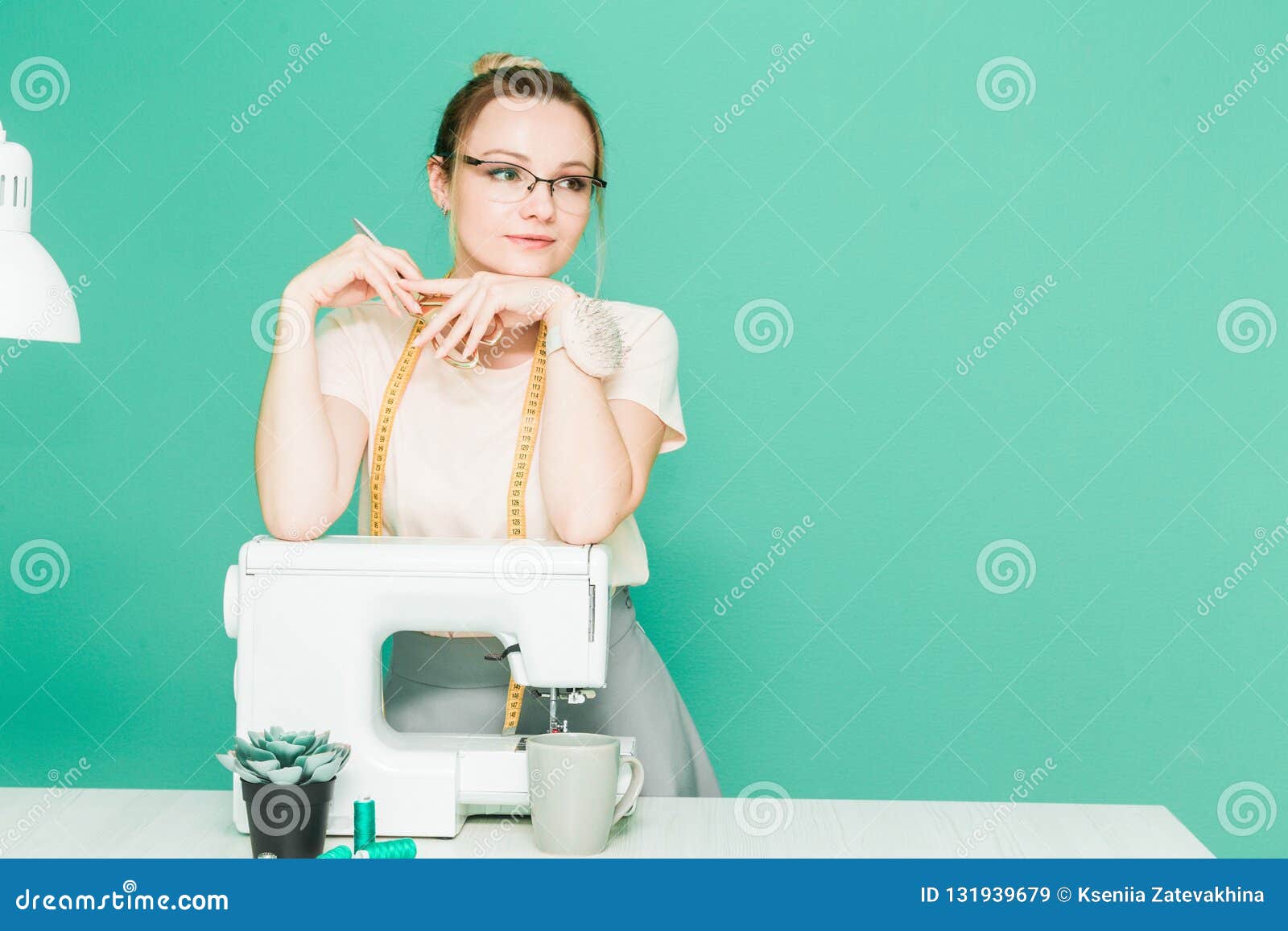 Sewing Workshop. Seamstress at Work. Portrait of a Young Dressmaker on ...