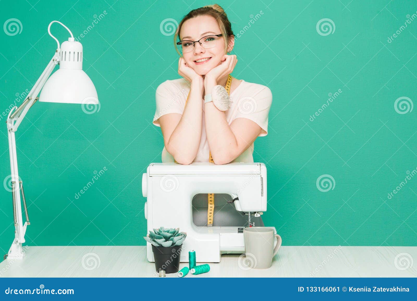Sewing Workshop. Seamstress at Work. Portrait of a Young Dressmaker on ...