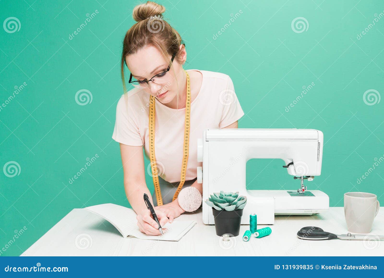 Young Dressmaker Female Sew On Sewing Machine. Professional Seamstress ...