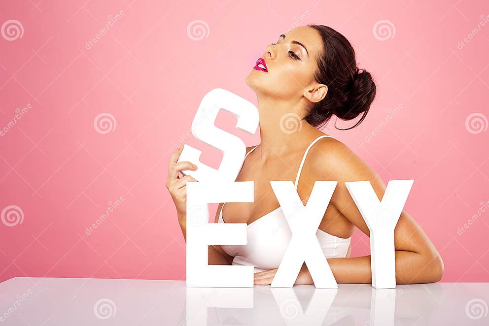 Sexig Kvinna Med Det Sexiga Ordet Arkivfoto Bild Av Förföriskt