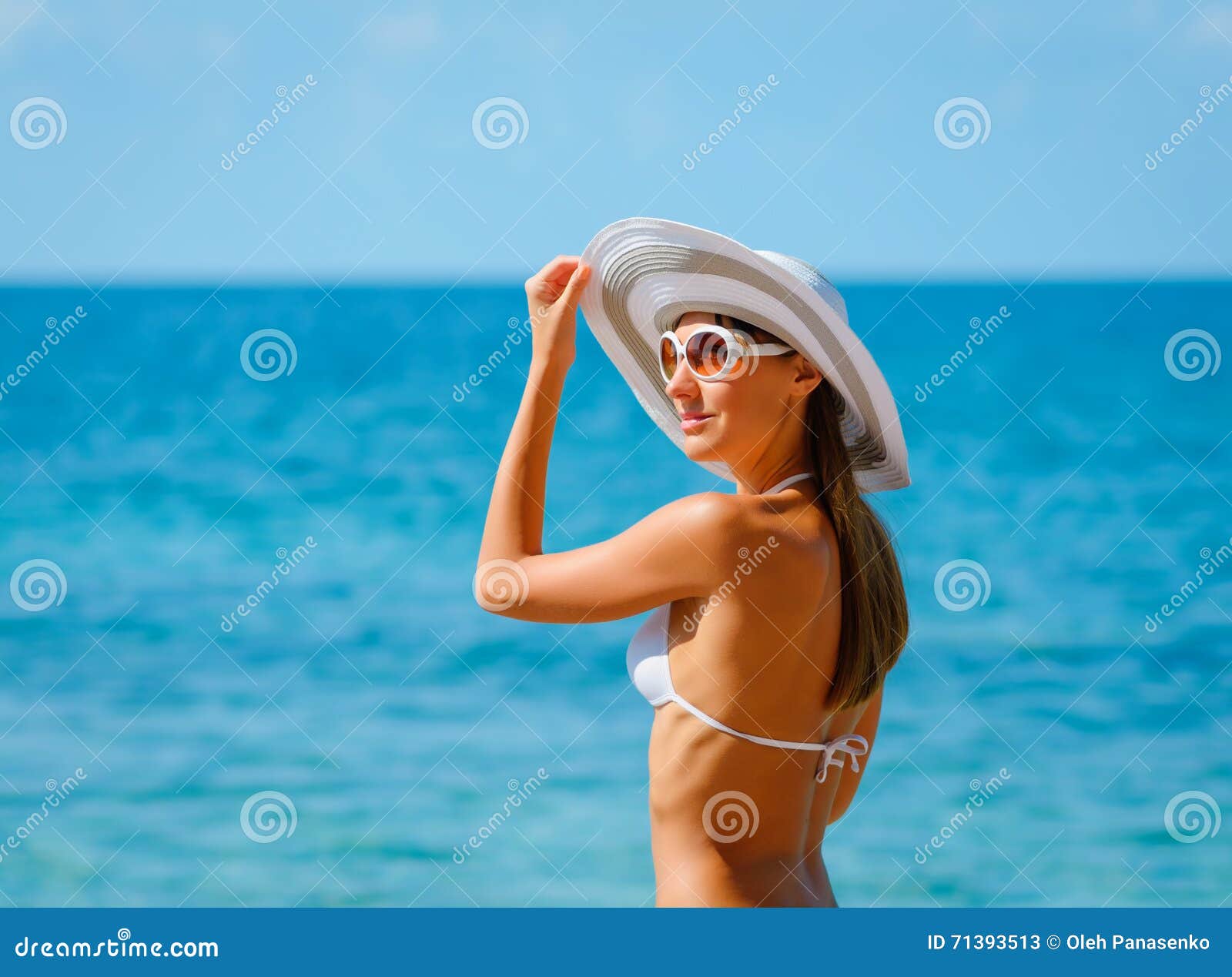 Beautiful Woman In White Bikini And Hat With Creative White Sunglasses