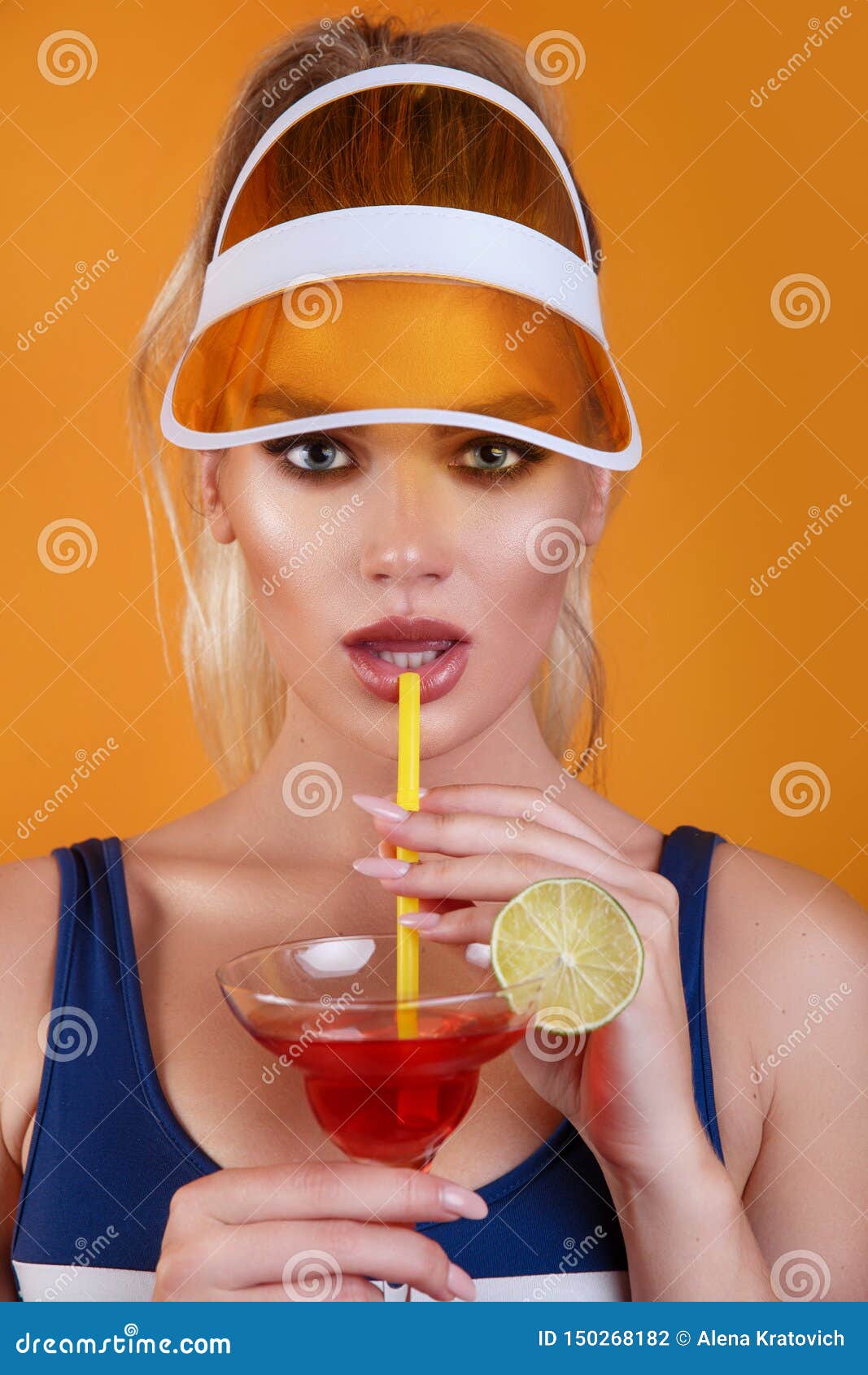 Woman In Swimsuit And Trendy Plastic Visor Holding Glass Of Fresh Drink