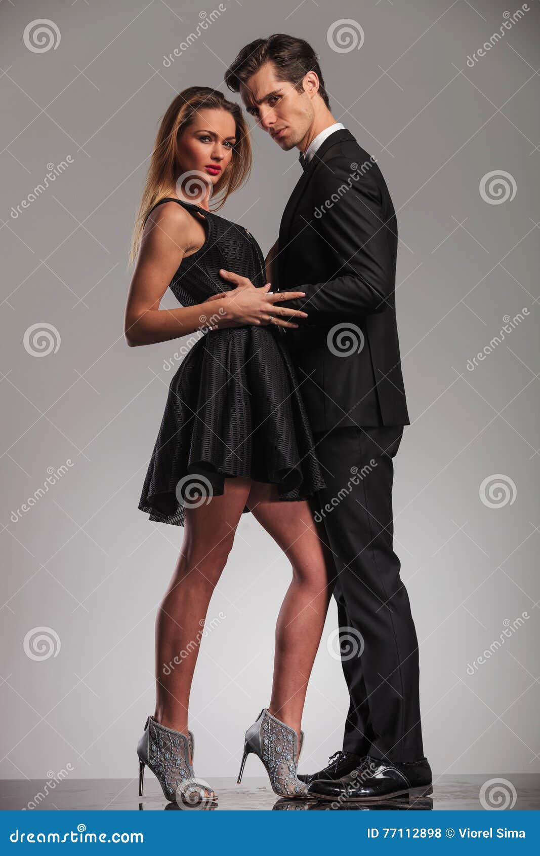 Couple in Elegant Clothes Standing Embraced Stock Photo - Image of ...