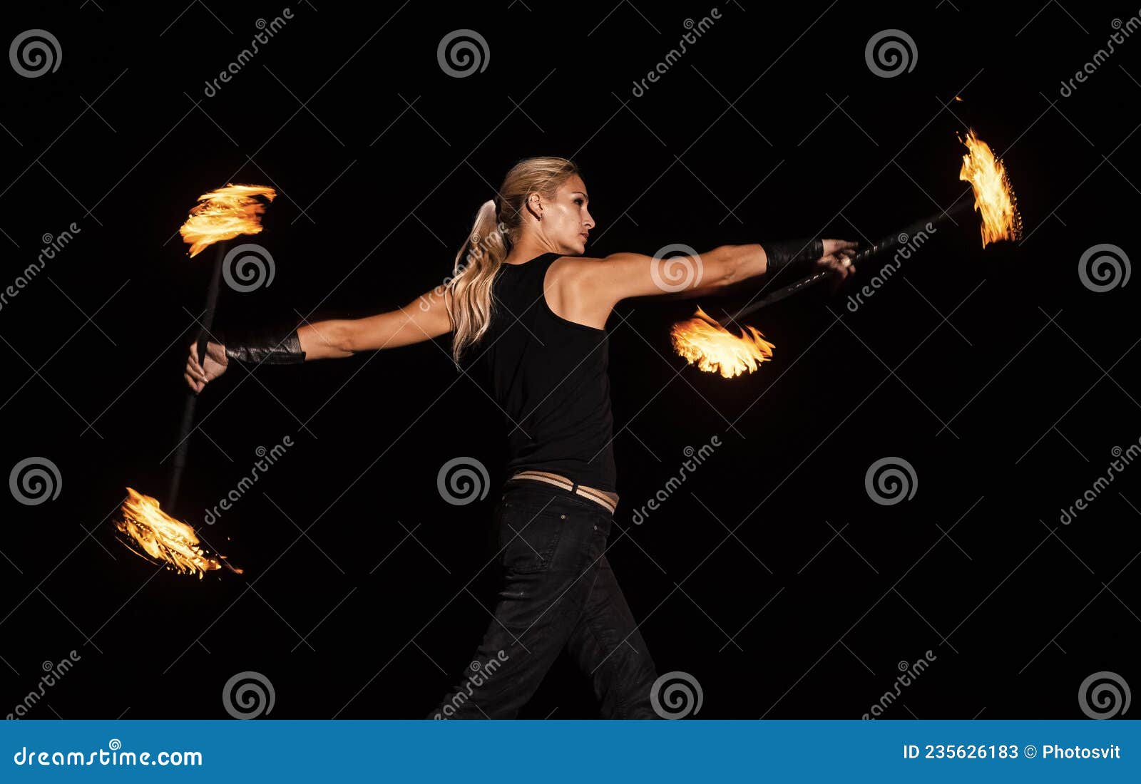 Fire Dancer Manipulate Burning Batons during Night Performance in Dark ...