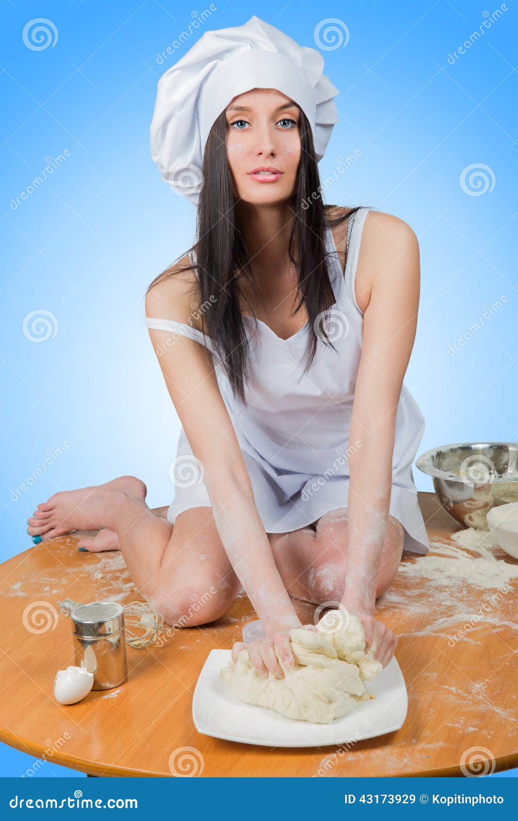 Sexy Girl Wearing Chef Prepares Dough Royalty Free Stock Image