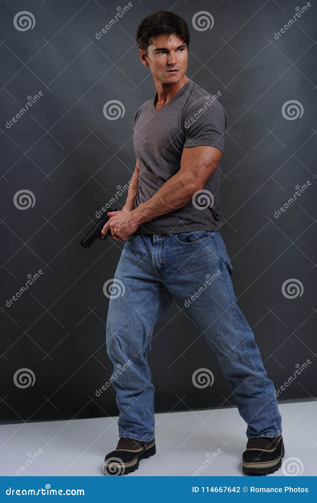 The man flexes his muscles stock photo. Image of hand - 114667642