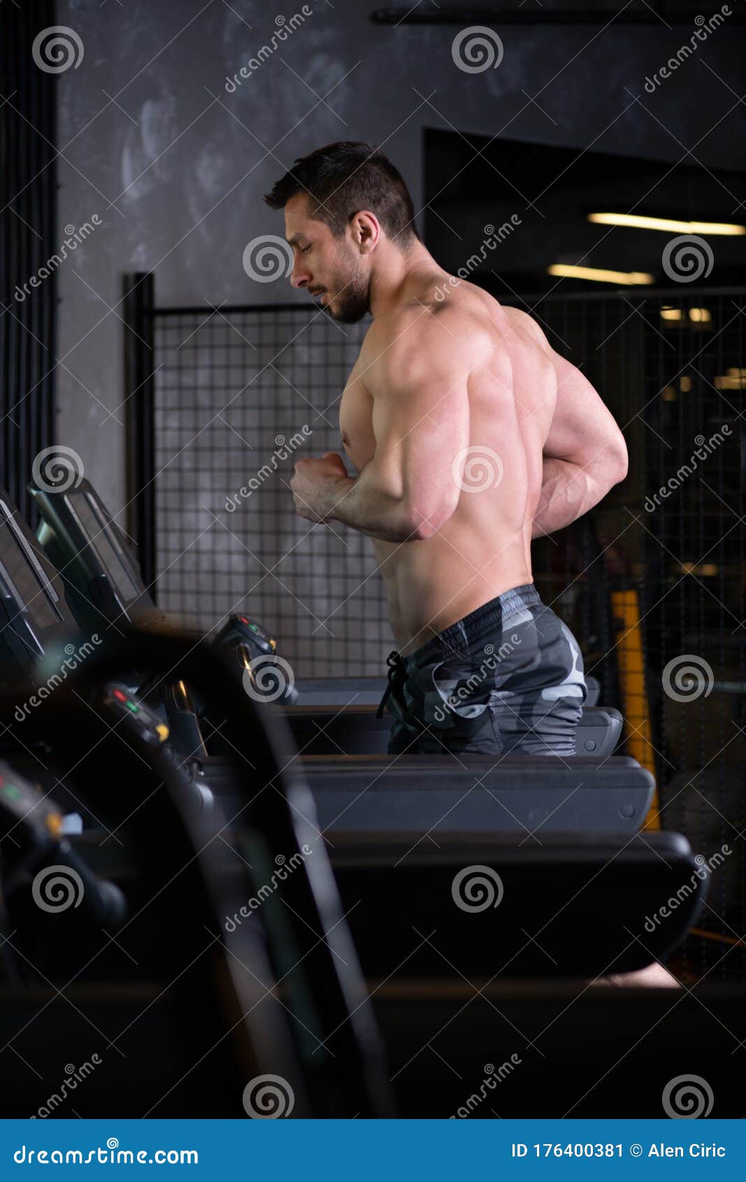 Muscular Young Man Running on the Treadmill at the Gym Stock Image ... Muscular Young Man Running on the Treadmill at the Gym Stock Image ...