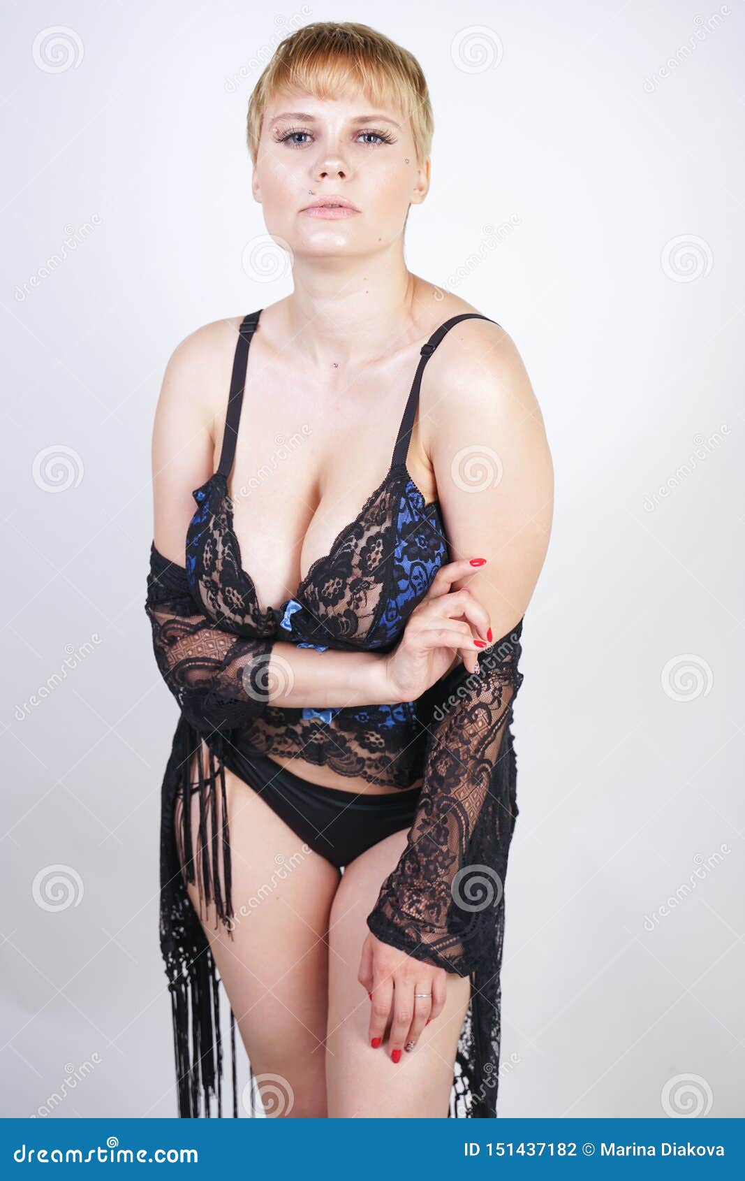Plus Size Woman With Short Hair In Blue And Black Lace Corset Lingerie