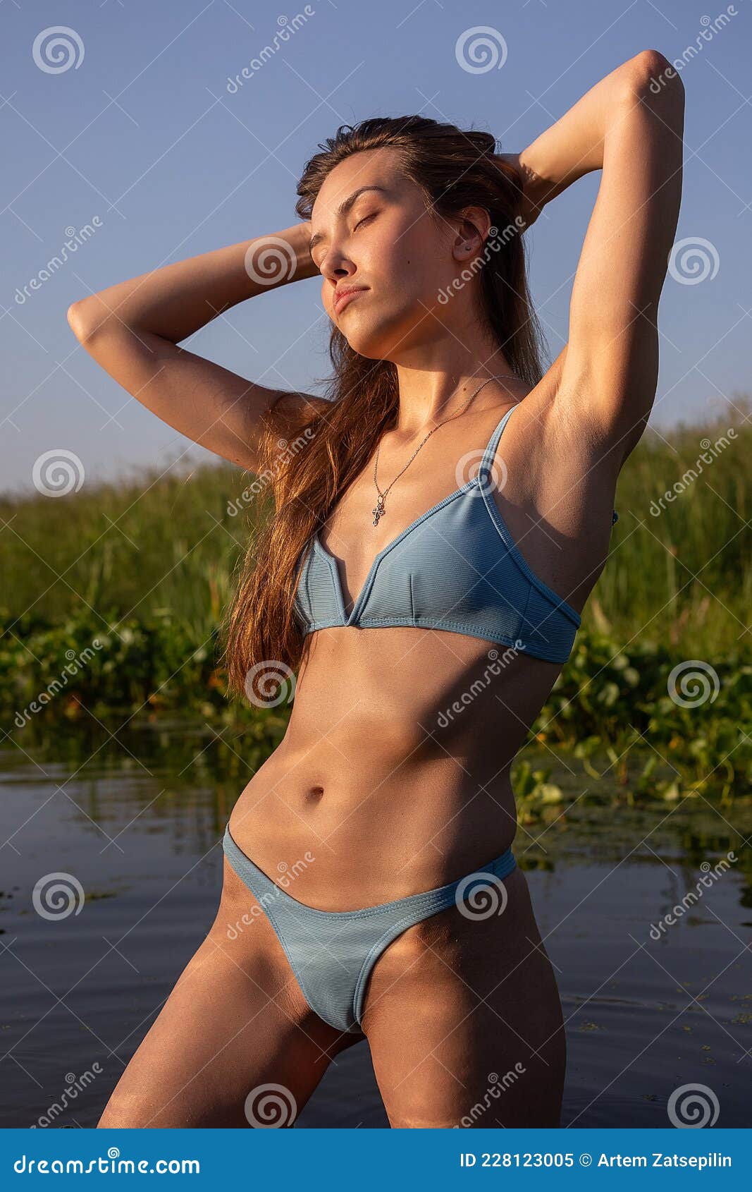 Seductive Young Thin Woman In Blue Bikini Standing In Lake Ready To