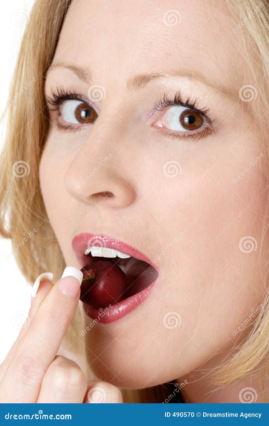 Woman eating a cherry stock photo. Image of enjoy, glamour - 490570