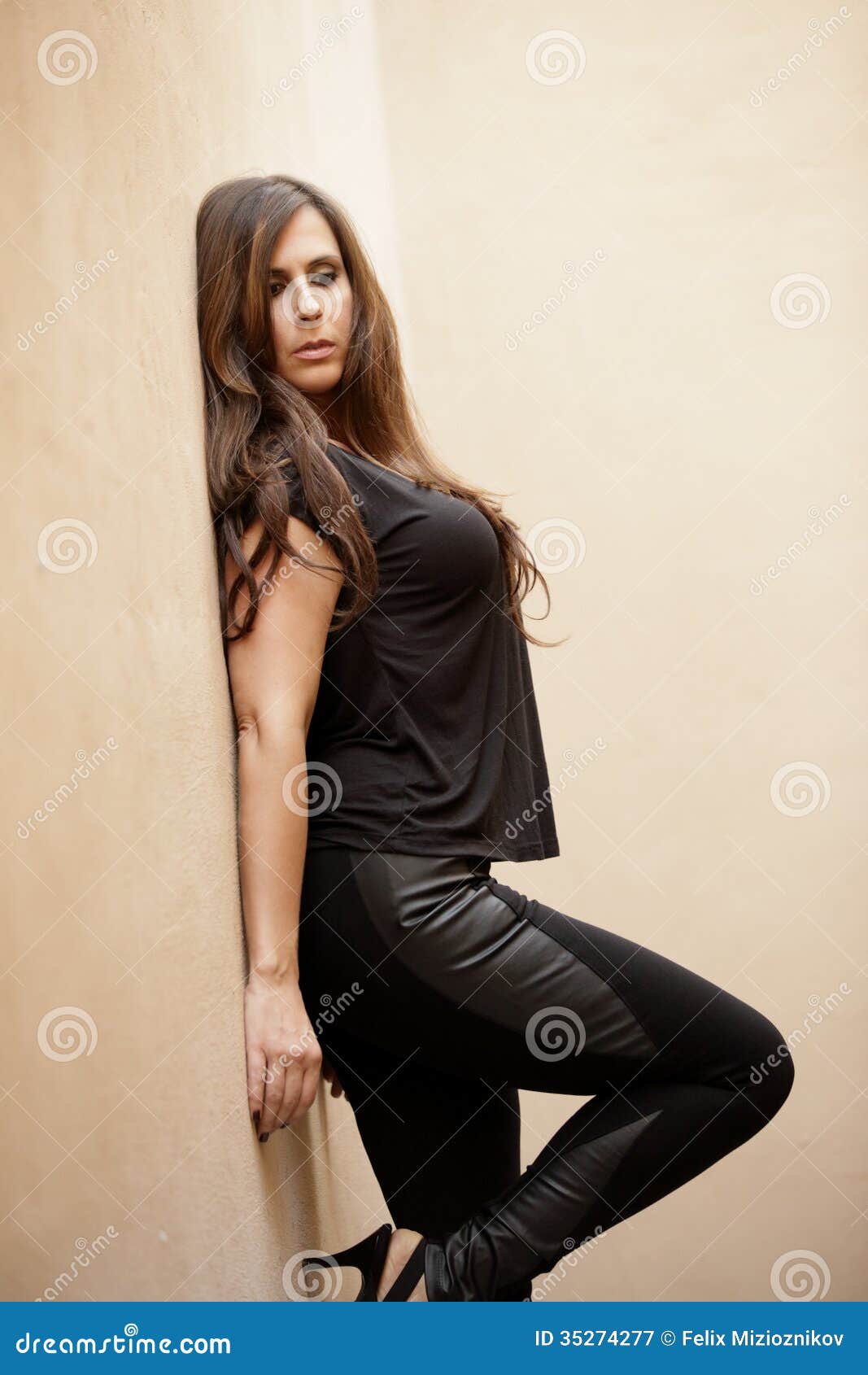 Woman leaning on the wall stock image. Image of beauty - 35274277