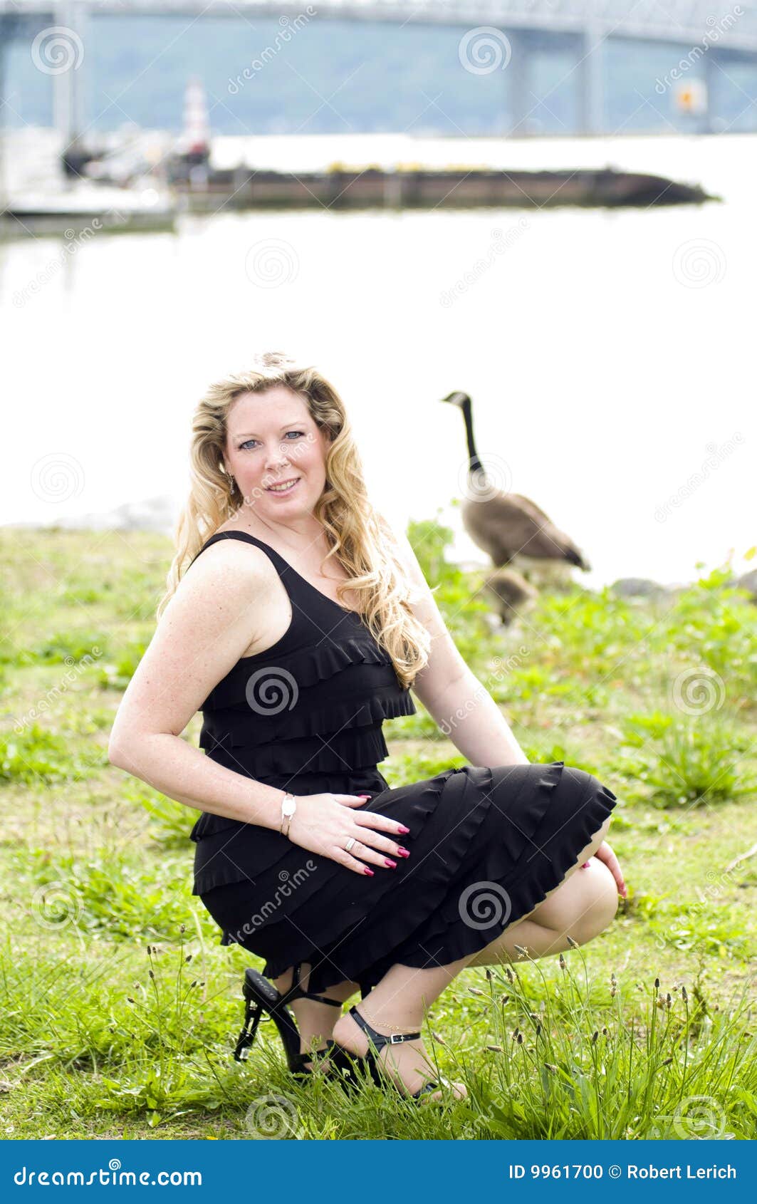 Woman posing by the river stock photo. Image of middle - 9961700