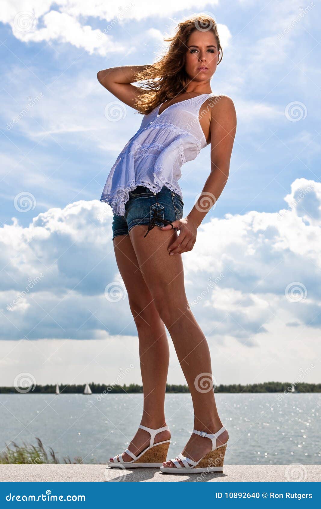 Woman posing in sunlight stock photo. Image of attractive - 10892640