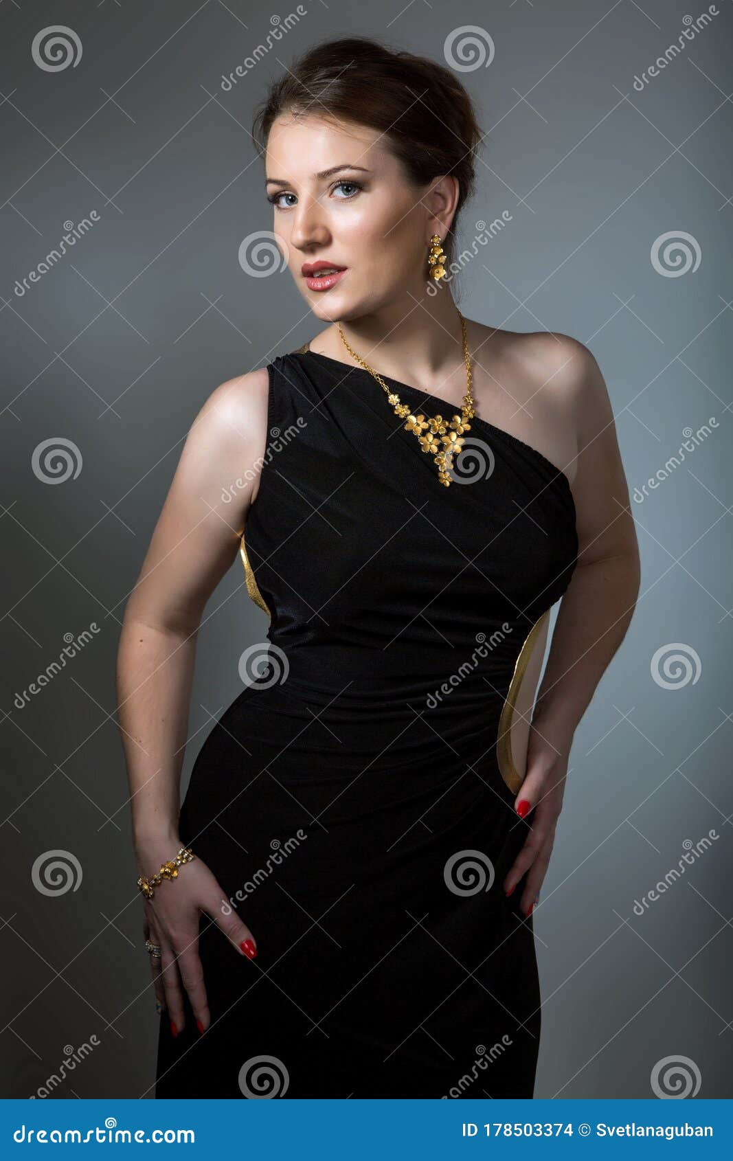 Young Brunette Woman Wearing Black Dress In Glamour Half Length On
