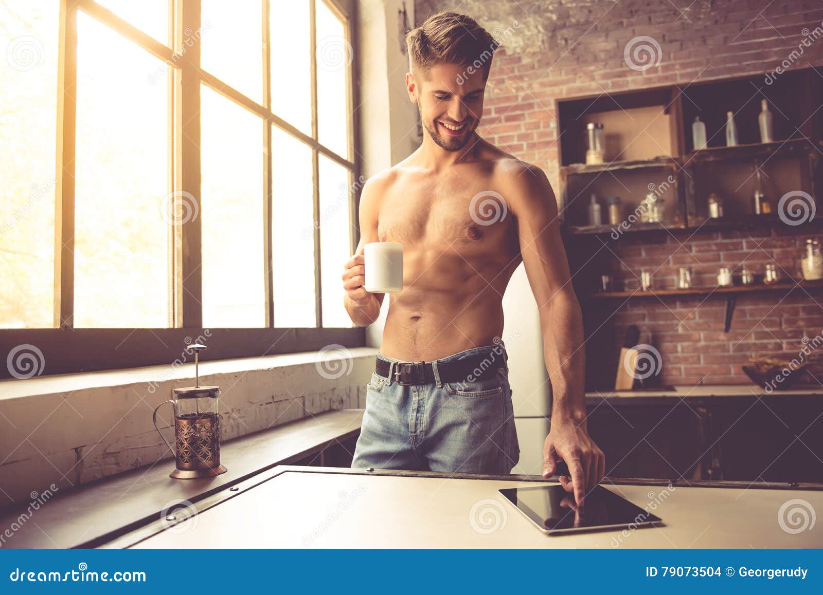 Young man in kitchen stock photo. Image of expression - 79073504